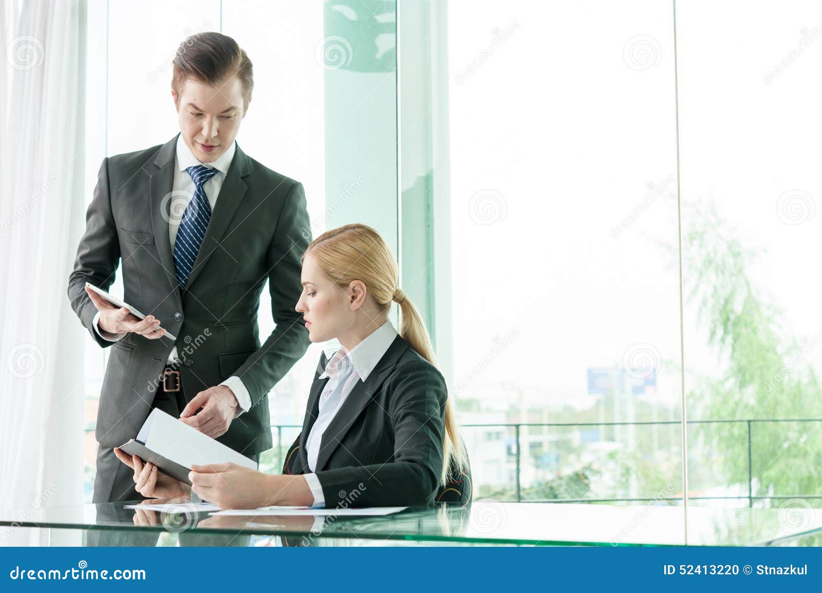 Business Partners Discussing Documents and Ideas Stock Photo - Image of ...