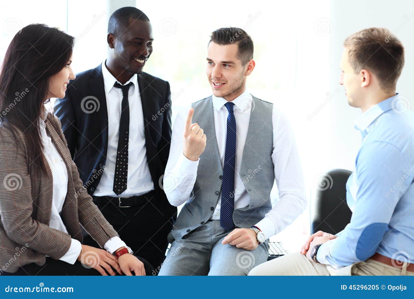 Business Partners Discussing Documents and Ideas at Meeting Stock Image ...