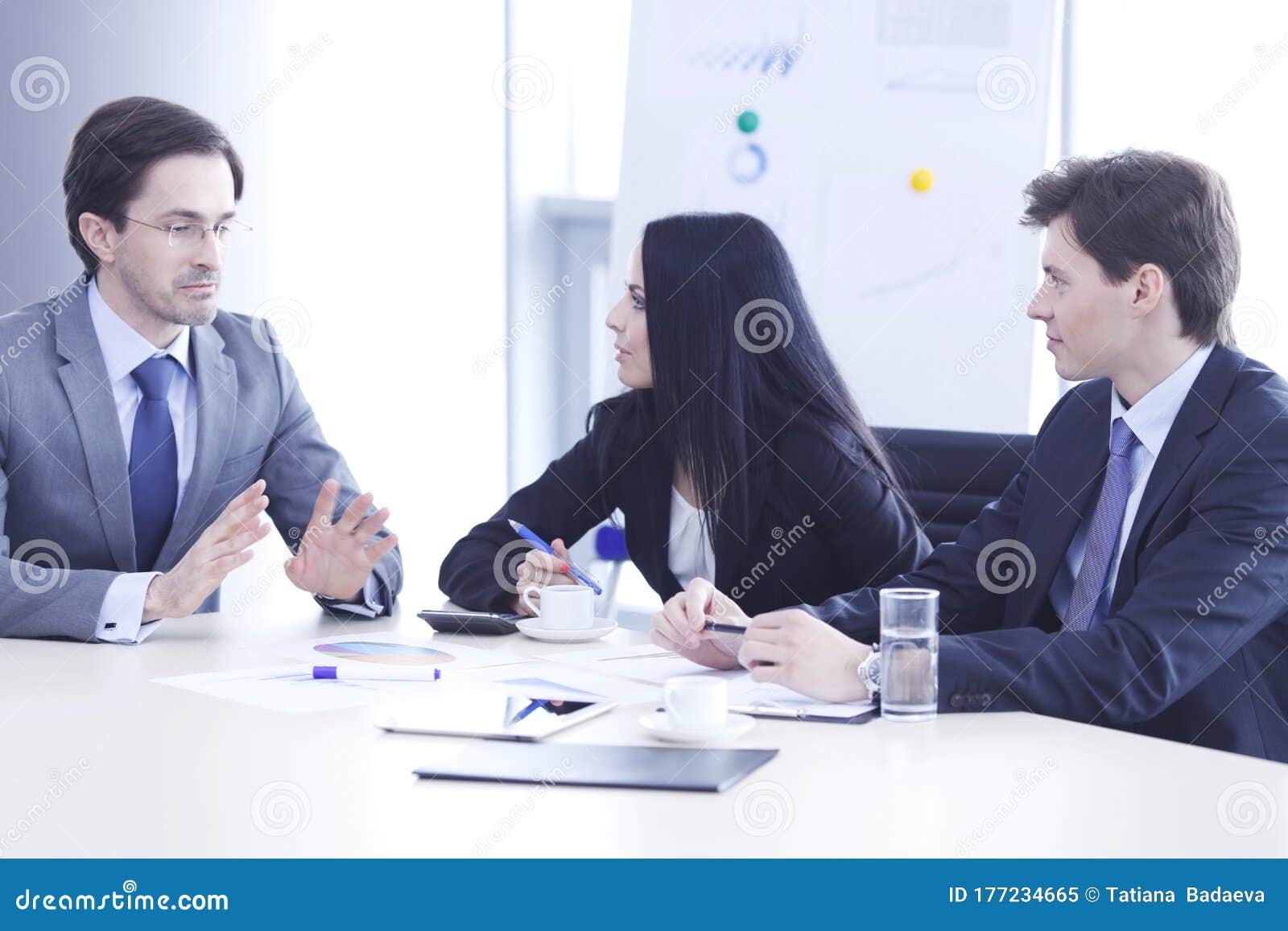 Business Partners Discussing Documents Stock Image - Image of attention ...