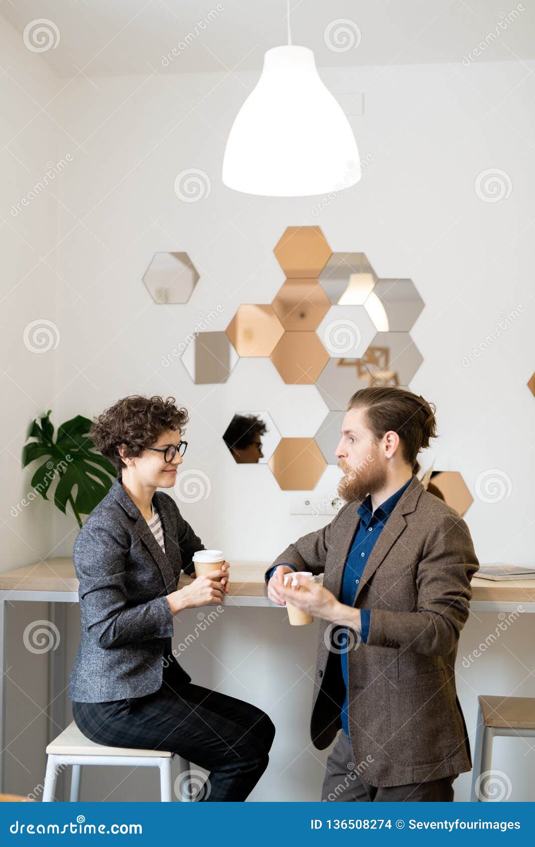 Business Partners Discussing Project Development in Cafe Stock Photo ...