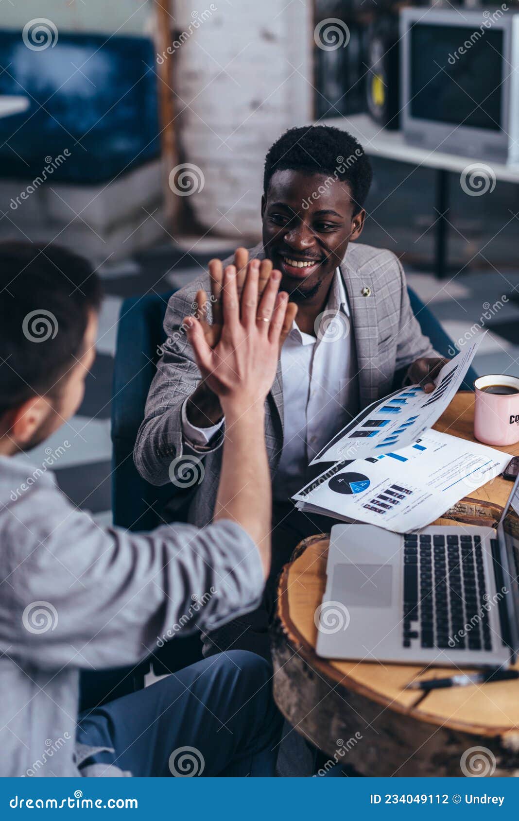 Business Partners Giving High Five at Table. Stock Photo - Image of ...