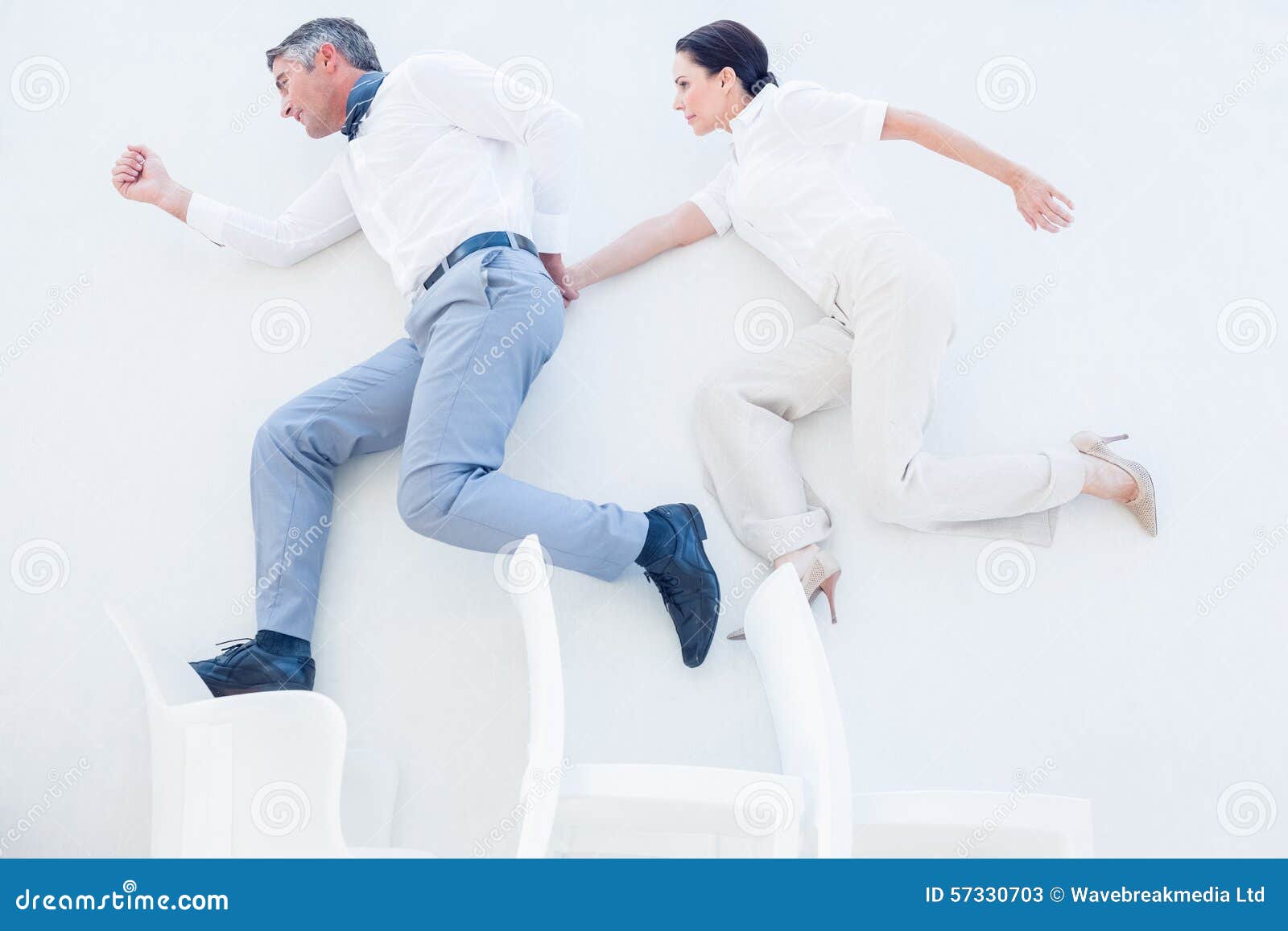 Business Partners Jumping Over Chairs Stock Image - Image of staff ...
