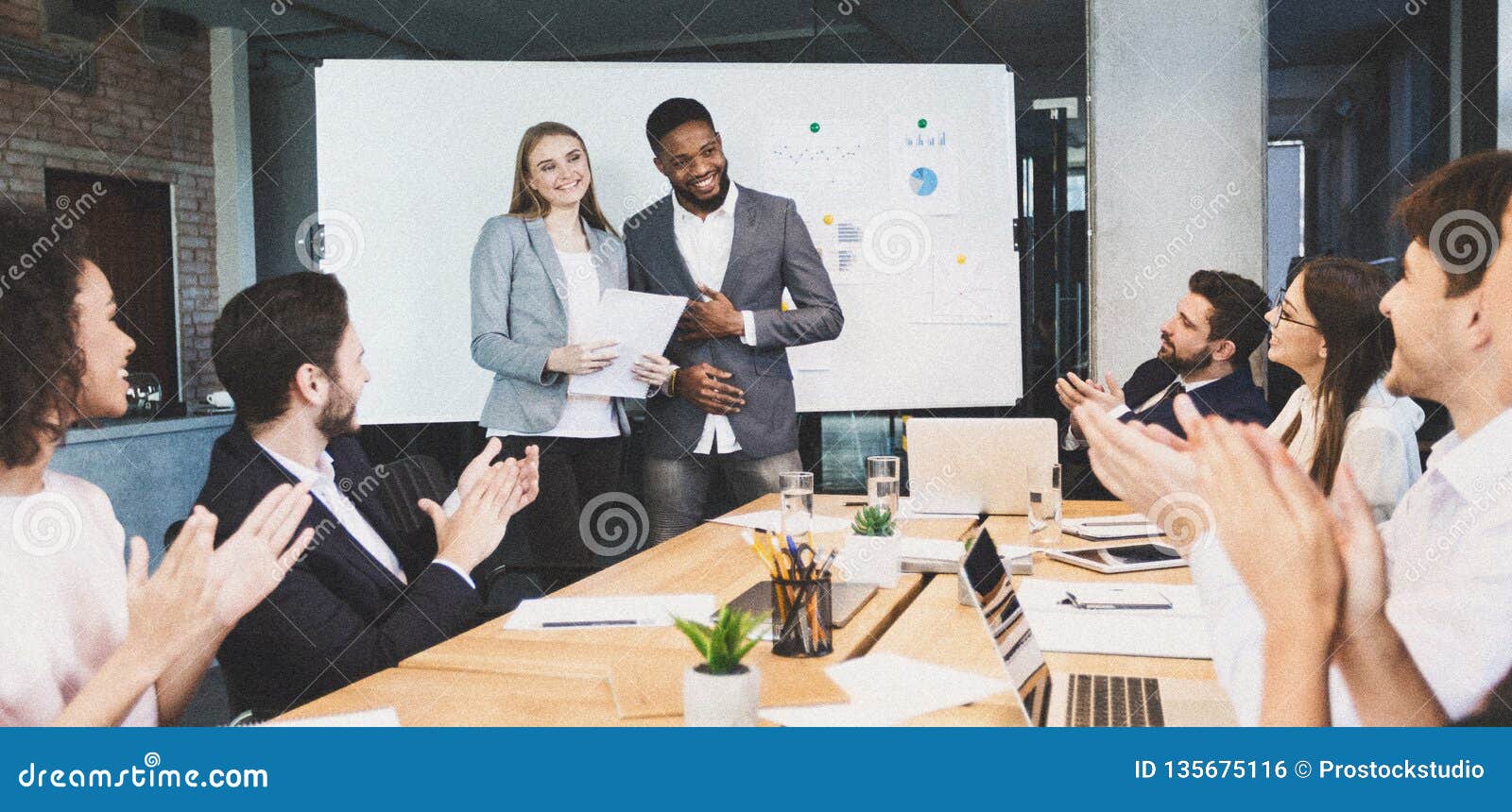 Business Partners Prising Co-workers for Presentation Stock Photo ...