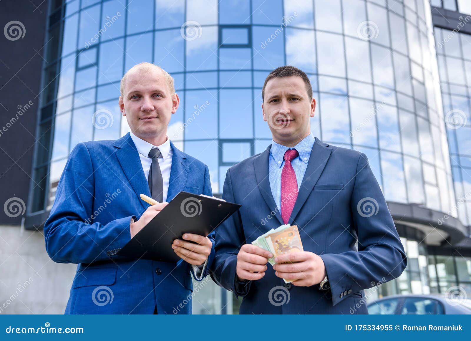 Business Partners in Suits Making Deal Standing Outdoors Stock Image ...