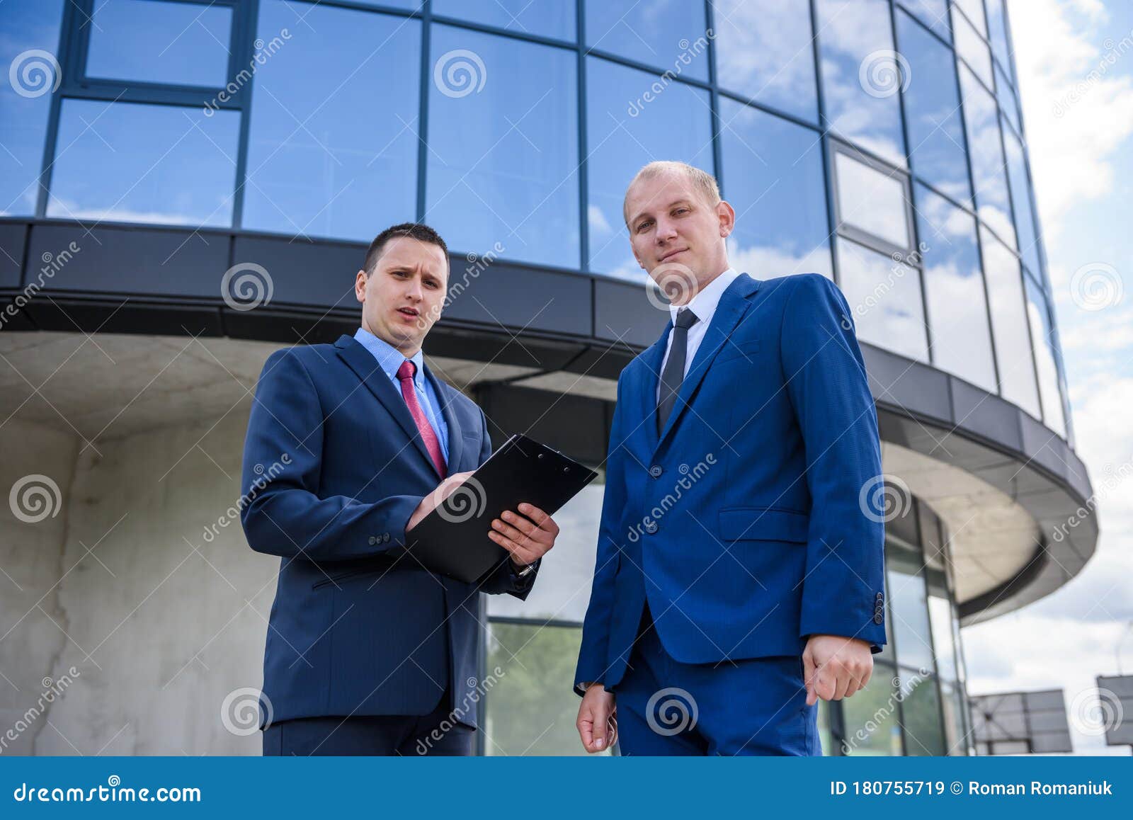 Business Partners in Suits Making Deal Standing Outdoors Stock Image ...