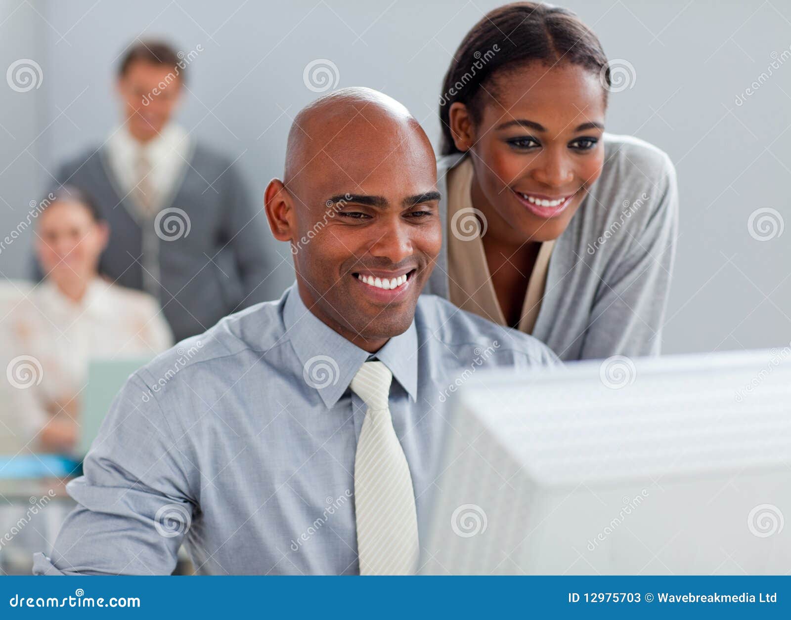 Business Partners Working at a Computer Together Stock Image - Image of ...
