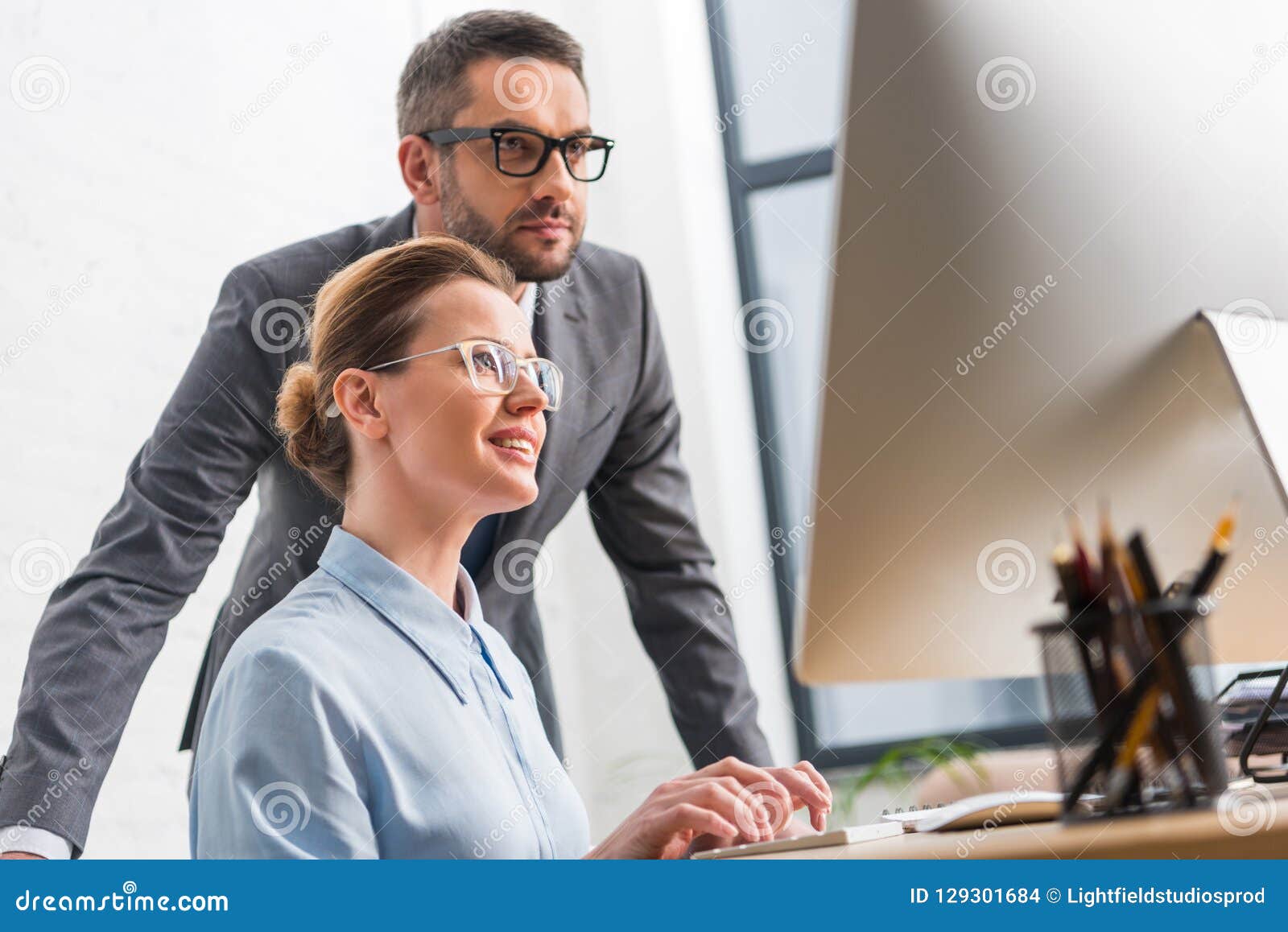 Business Partners Working with Computer Together Stock Photo - Image of ...