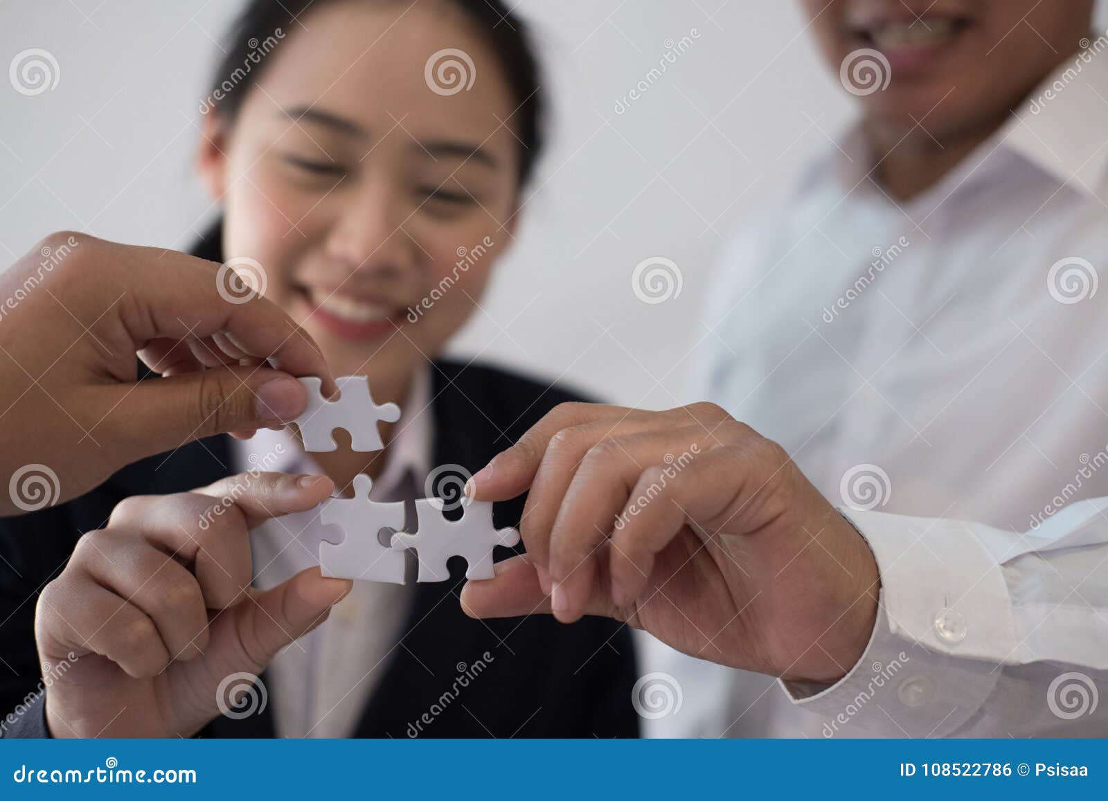 Business People Assembling Piece of Puzzle Together. Co Worker T Stock ...