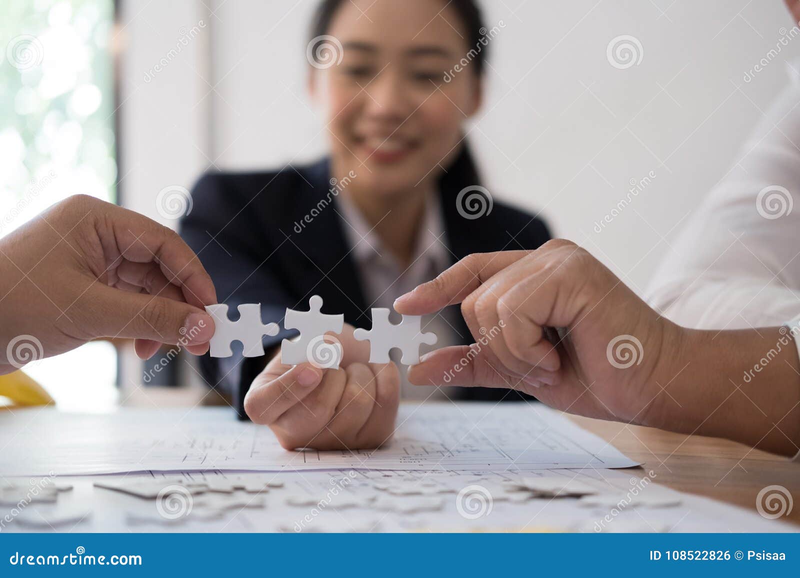 Business People Assembling Piece of Puzzle Together. Co Worker T Stock ...