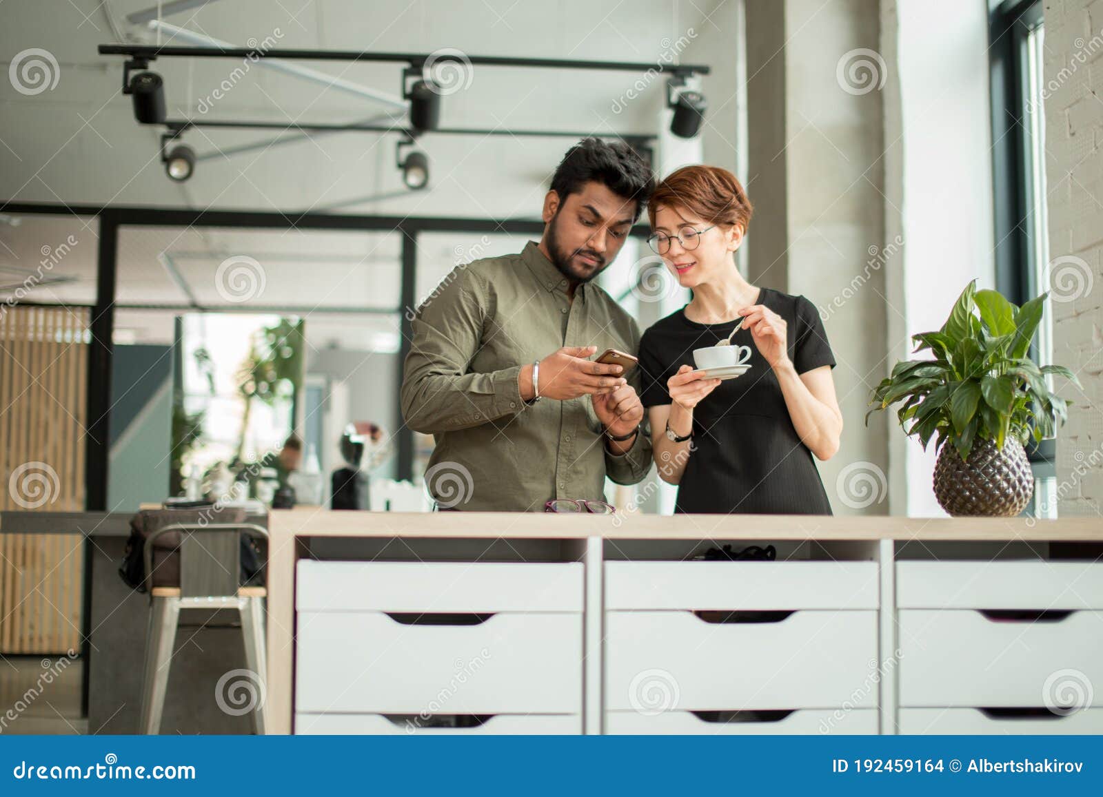 Business People Chatting in Office at Lunch or Coffee Break Stock Photo ...