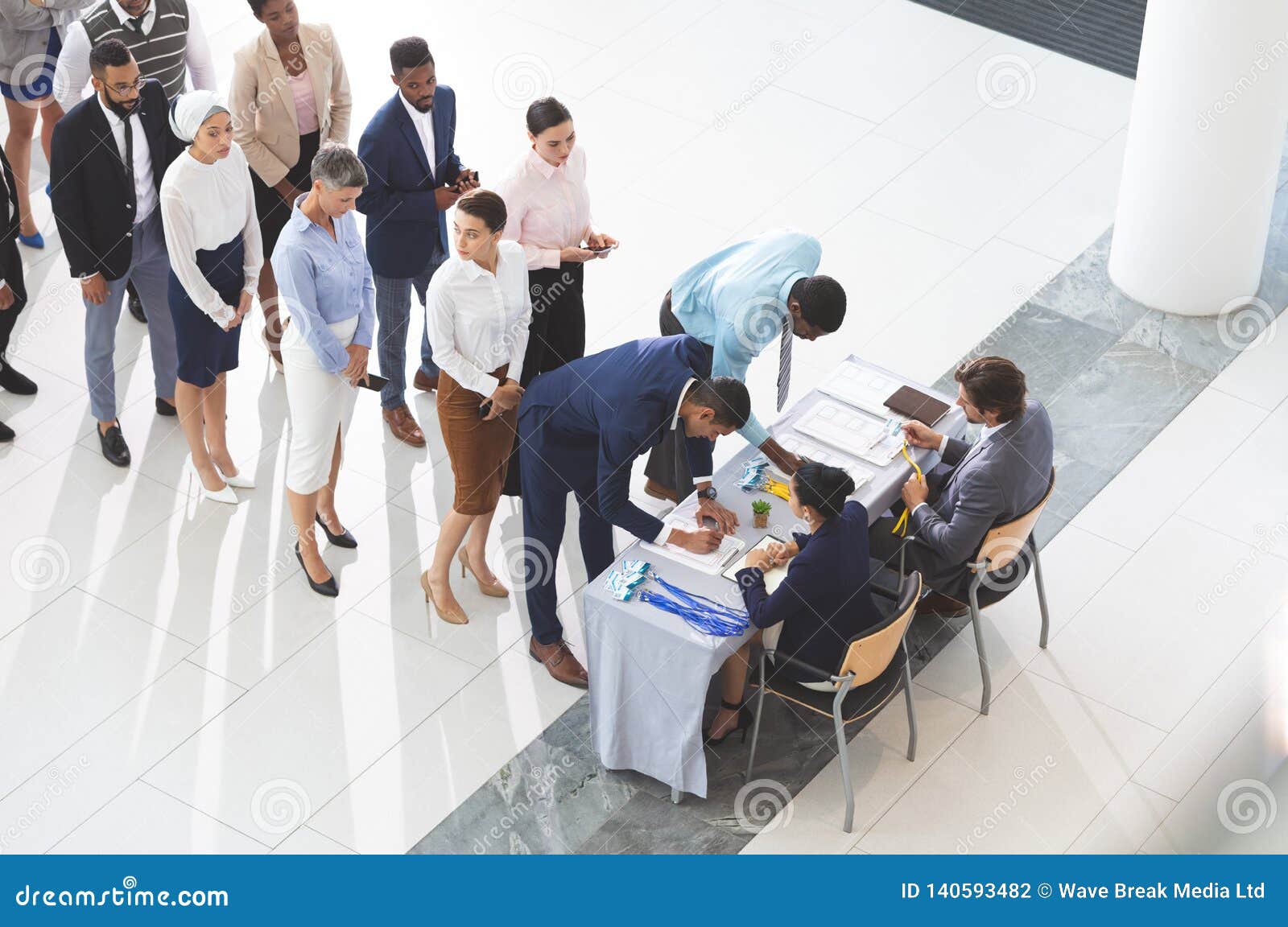 Business People Checking in at Conference Registration Table Stock ...