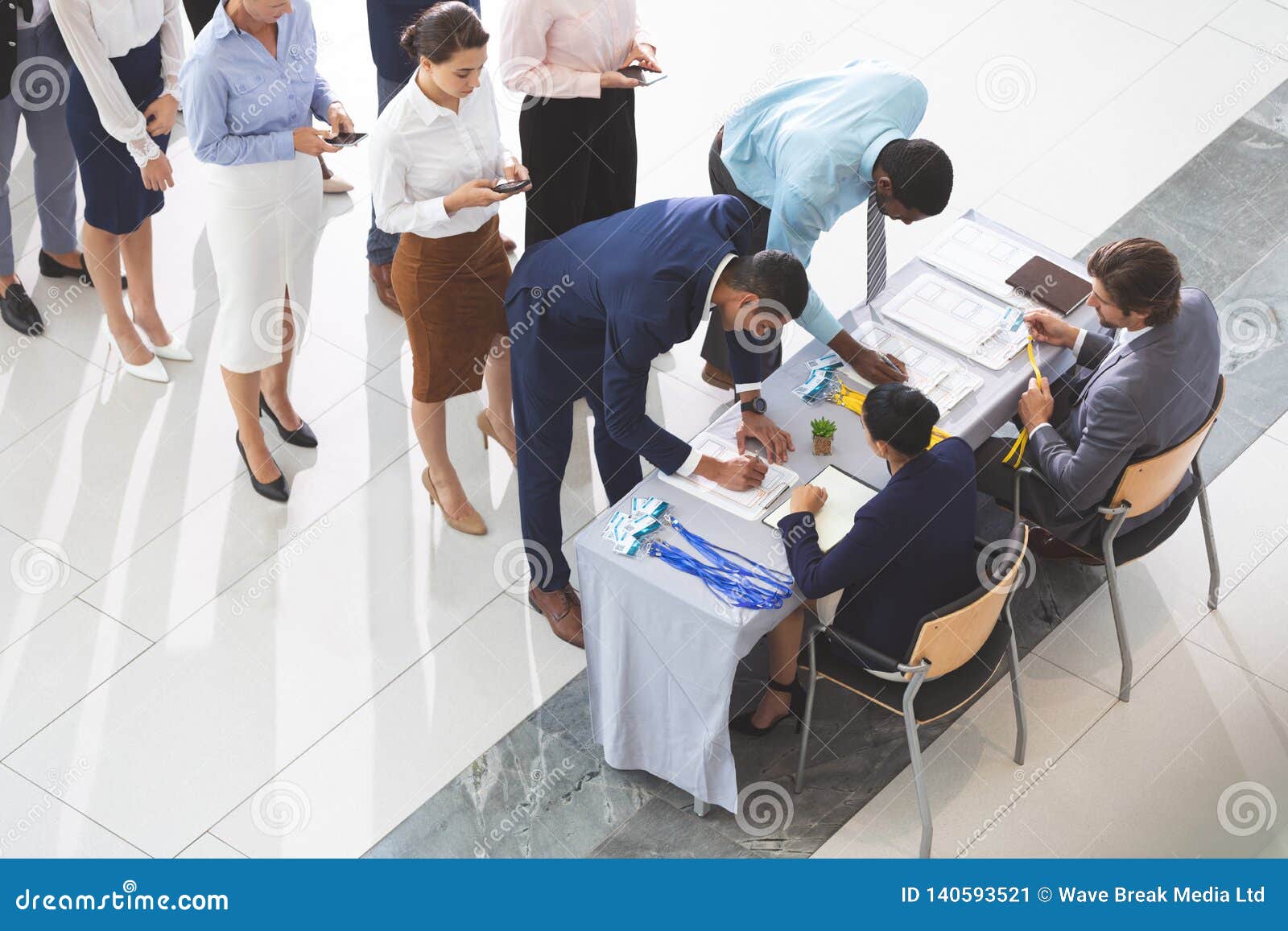 Business People Checking in at Conference Registration Table Stock ...