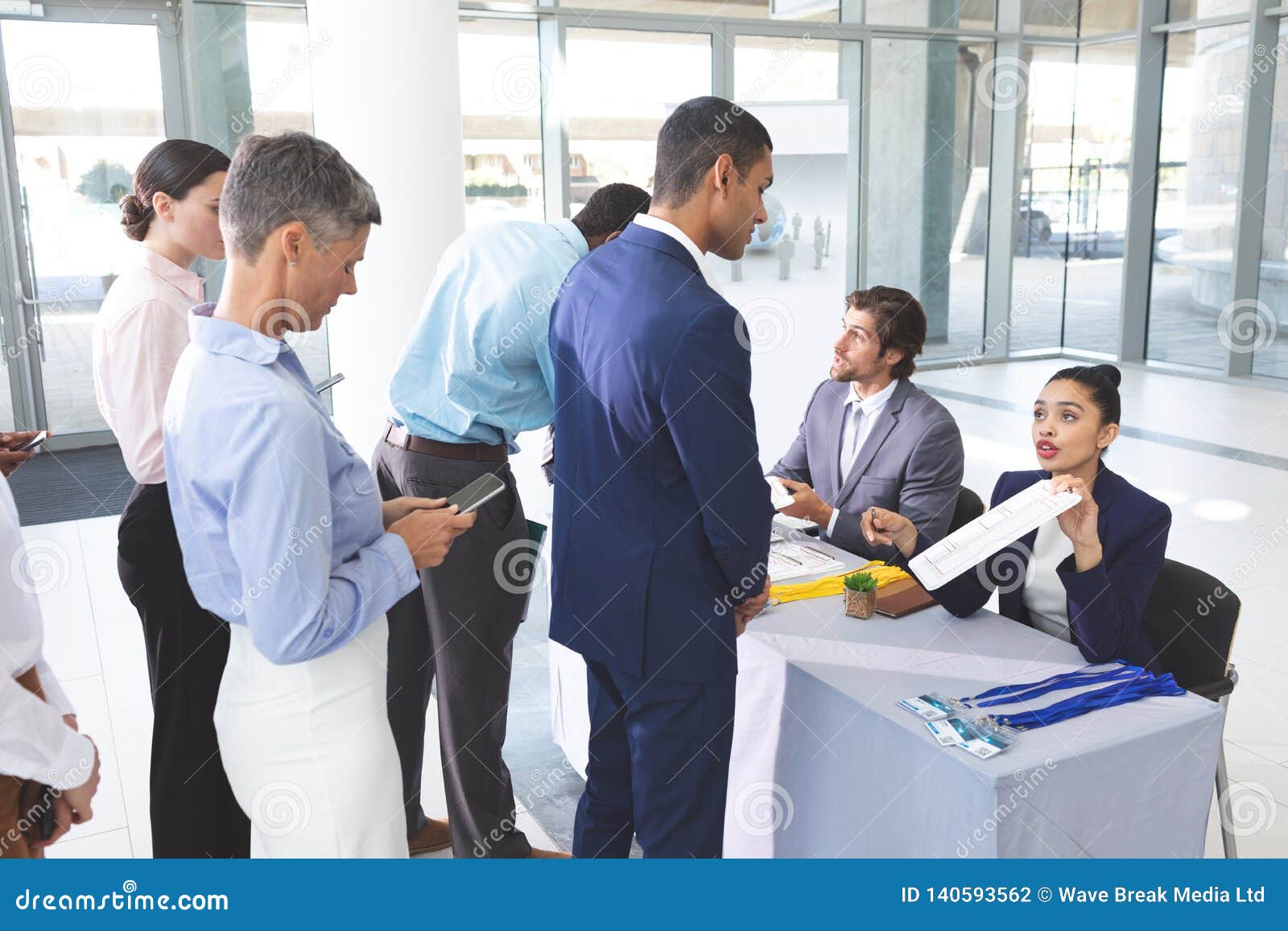 Business People Checking in at Conference Registration Table Stock ...