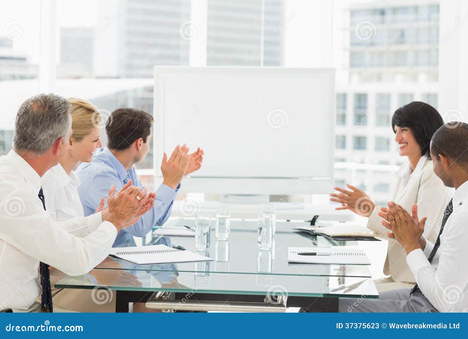 Business People Clapping at Blank Whiteboard in Conference Room Stock ...