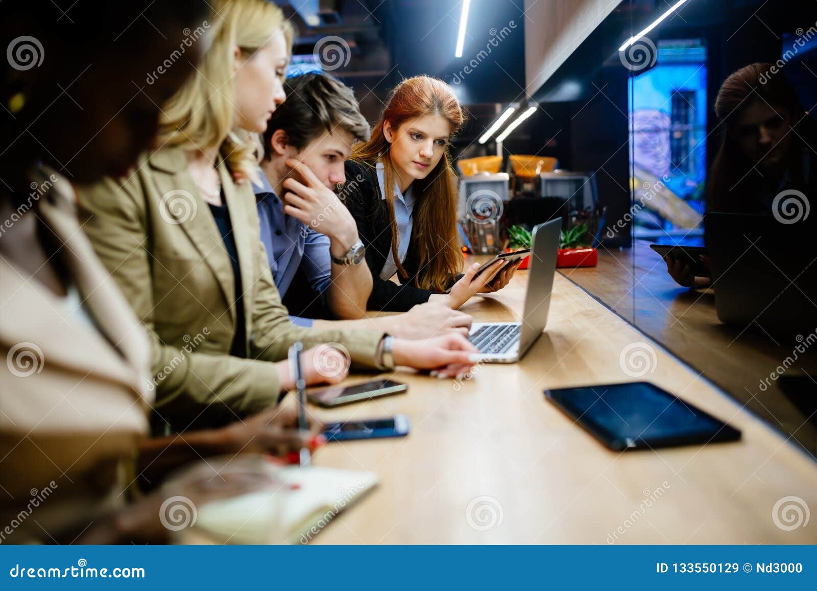 Business People Collaborating in Office and Working on Project Together ...