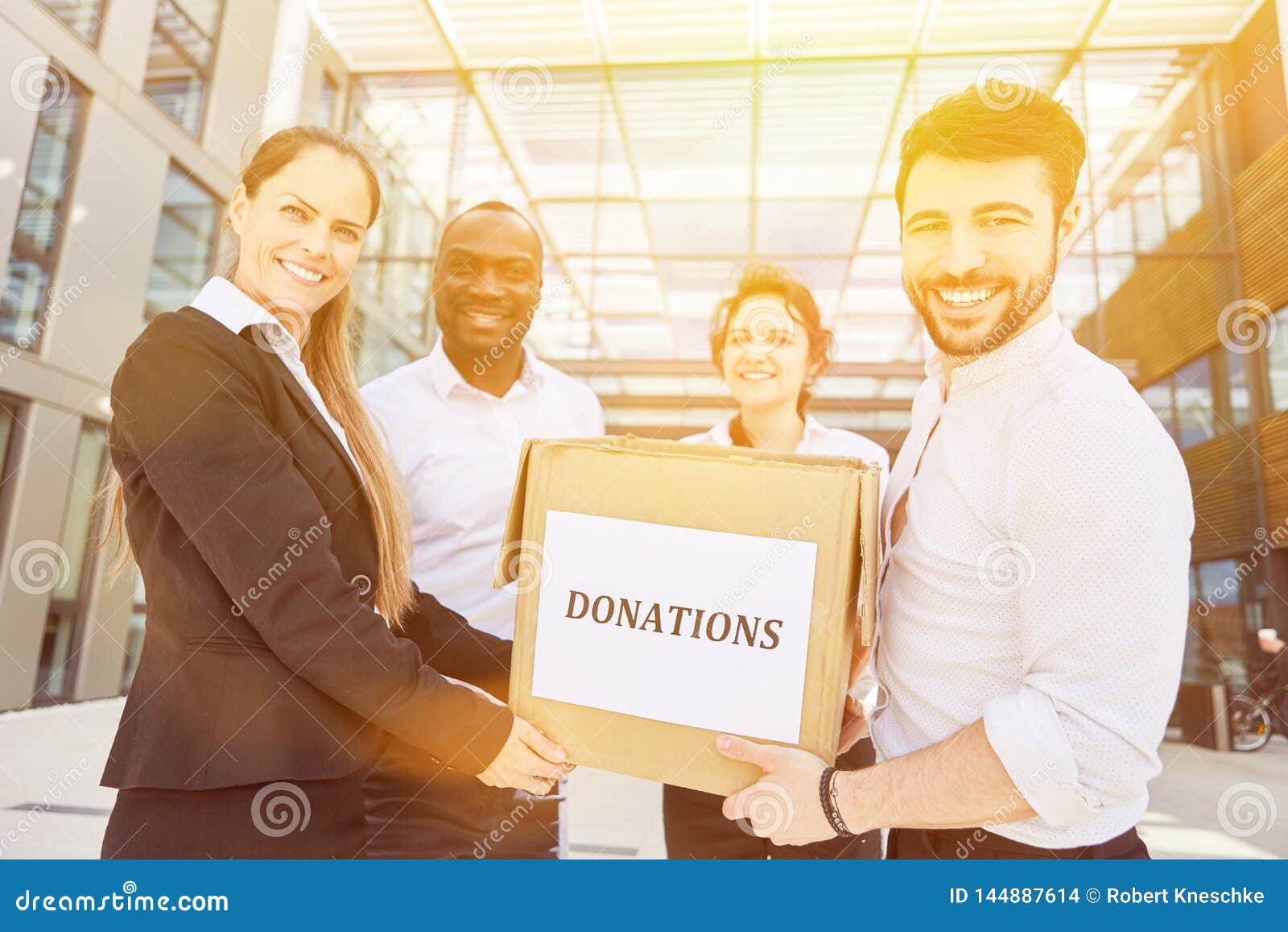 Business People Collecting Donations in Front of Office Stock Photo ...