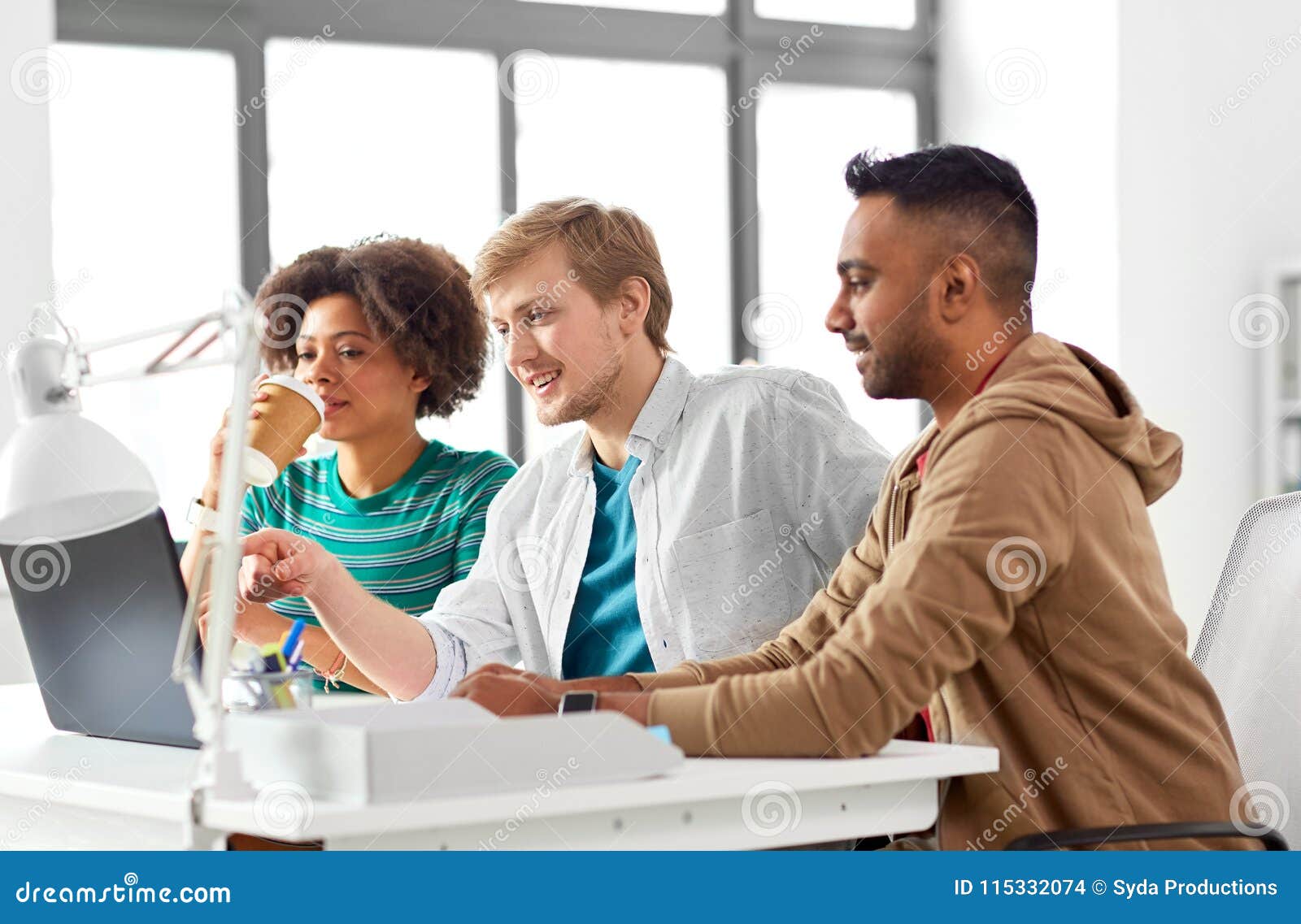 Happy Creative Workers with Laptops at Office Stock Photo - Image of ...