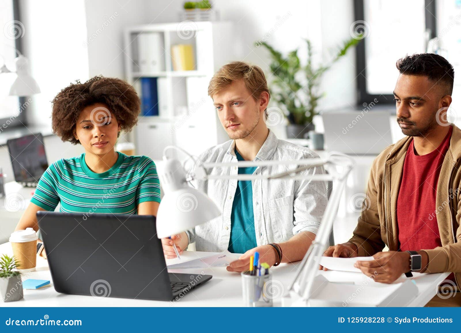 Happy Creative Workers with Laptops at Office Stock Photo - Image of ...
