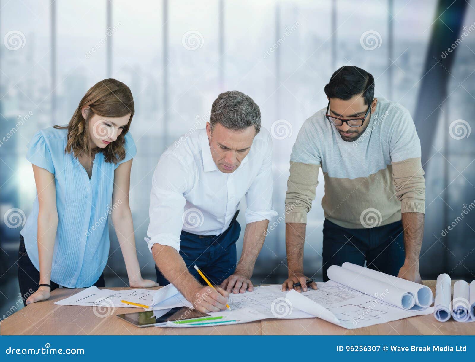 Business People at a Desk Looking at a Paper Stock Image - Image of ...