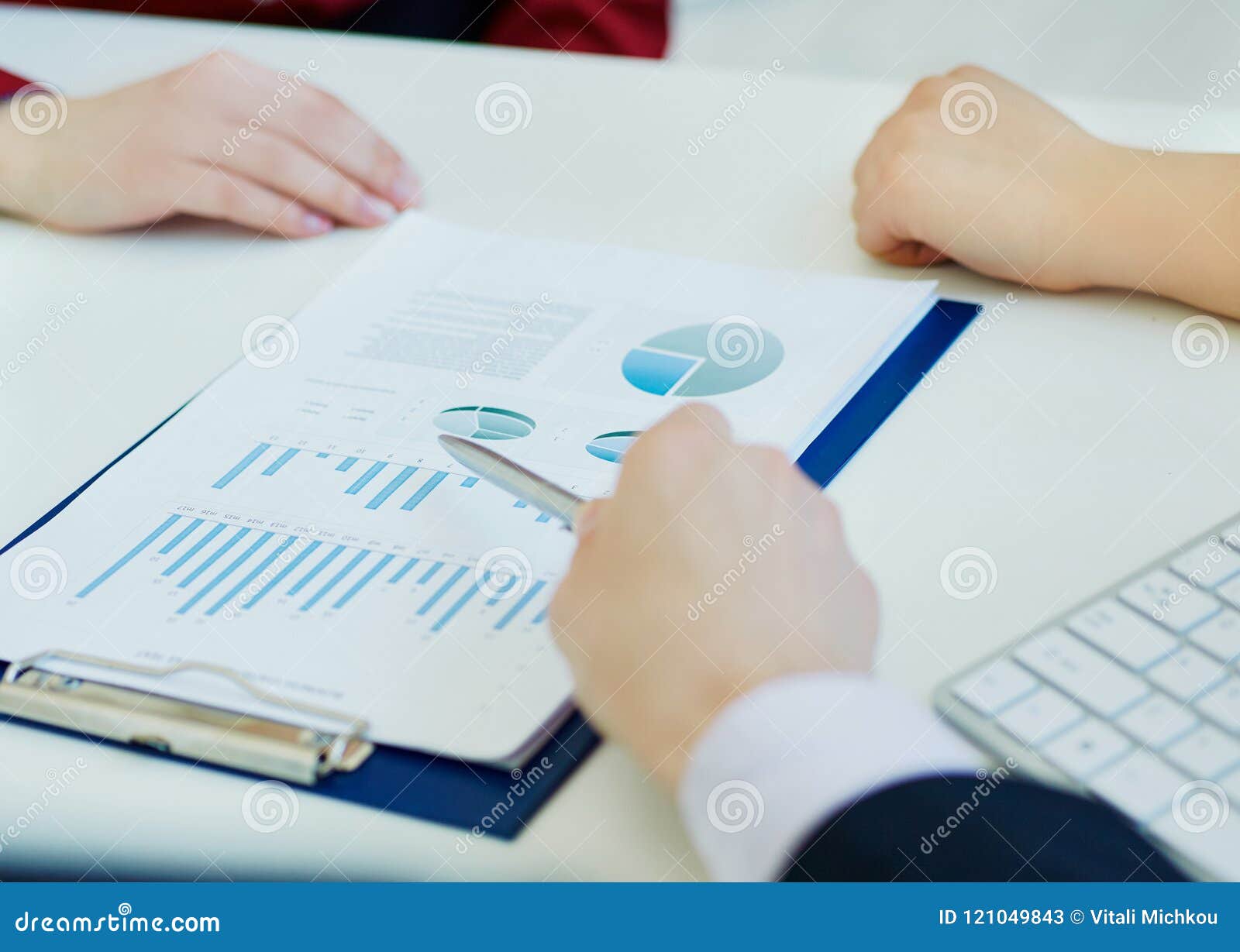 Business People Discussing and Analyzing Graph Data at the Meeting ... Business People Discussing and Analyzing Graph Data at the Meeting ...
