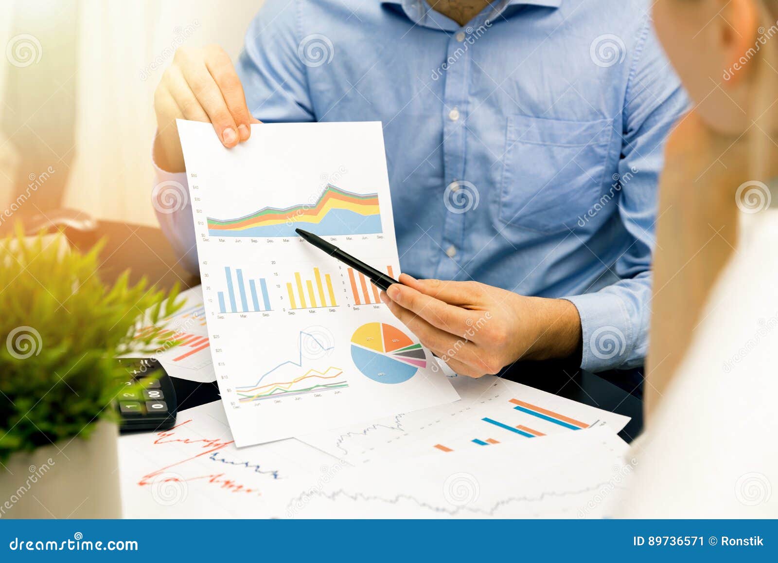 Business People Discussing Graph and Chart Reports at Office Stock ...