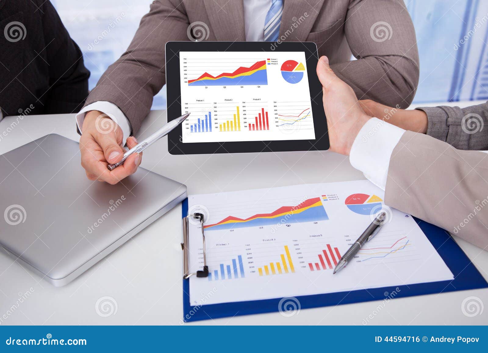 Business People Discussing Graph on Digital Tablet in Office Stock ...
