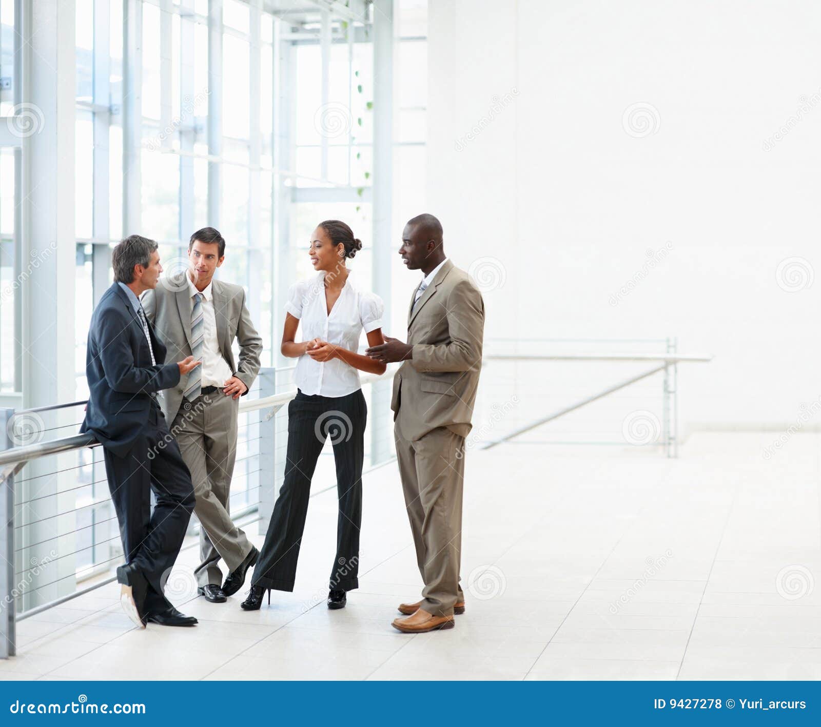 Business People Discussing at the Hallway Stock Photo - Image of human ...