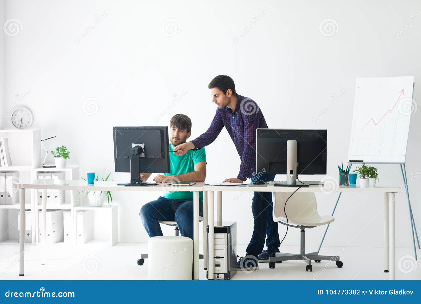 Business People Discussing Ideas at Meeting Using Computer Stock Photo ...