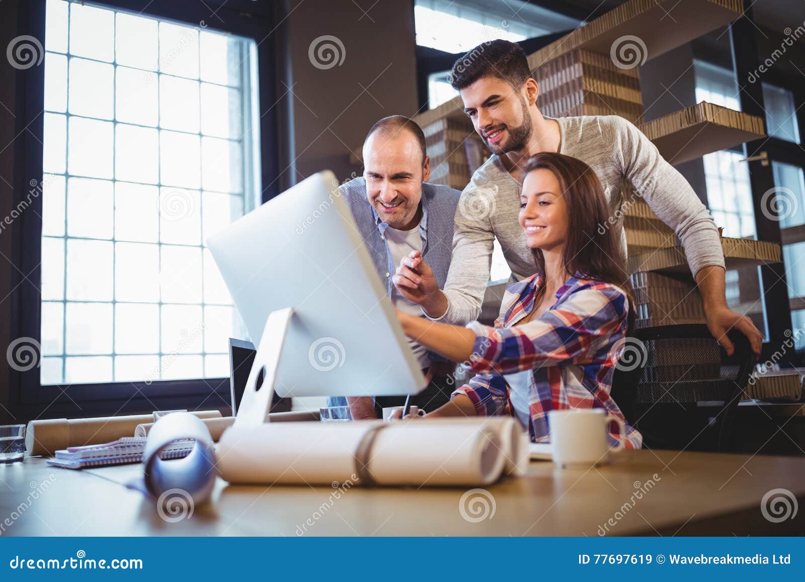 Business People Discussing Over Computer in Creative Office Stock Image ...