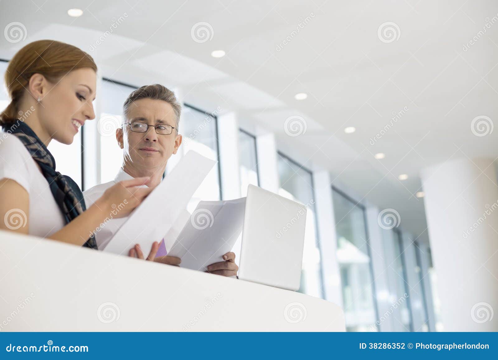 Business People Discussing Over Documents in Office Stock Photo - Image ...