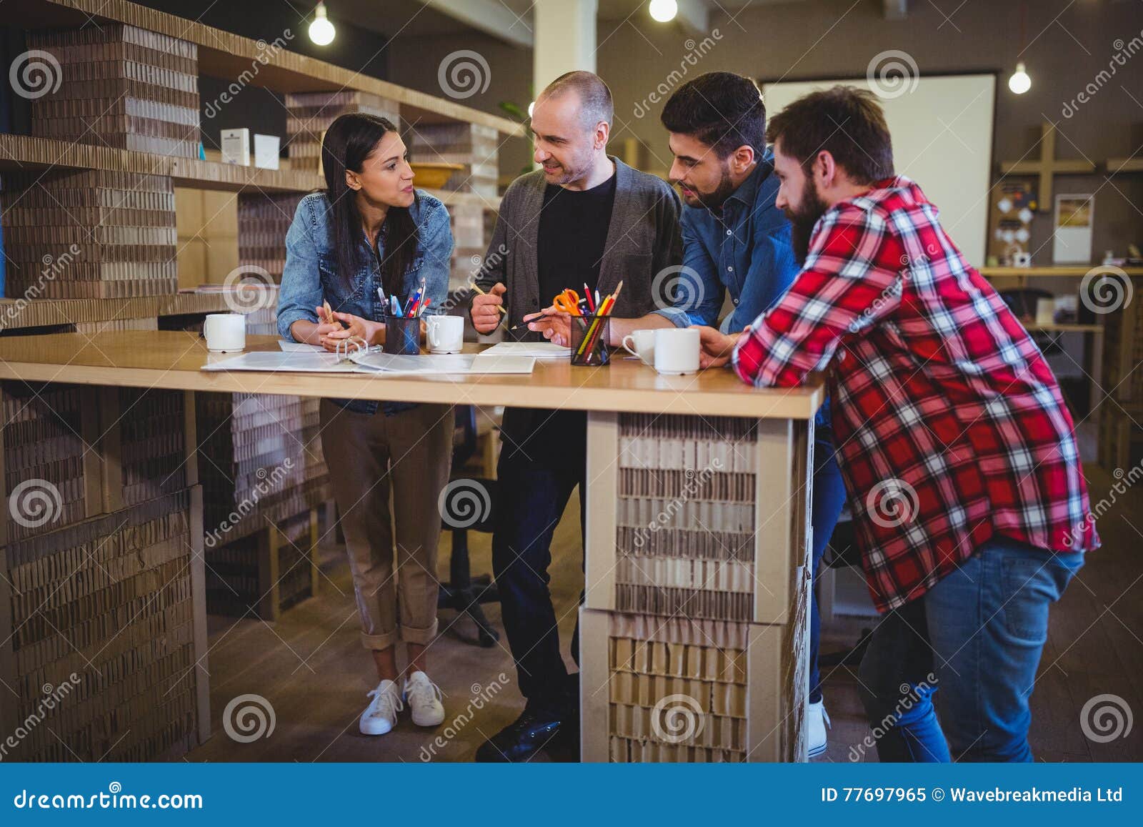 Business People Discussing Over Documents at Table Stock Image - Image ...