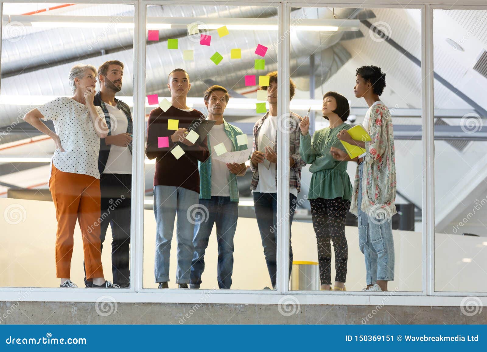 Business People Discussing Over Sticky Notes in the Office Stock Image ...