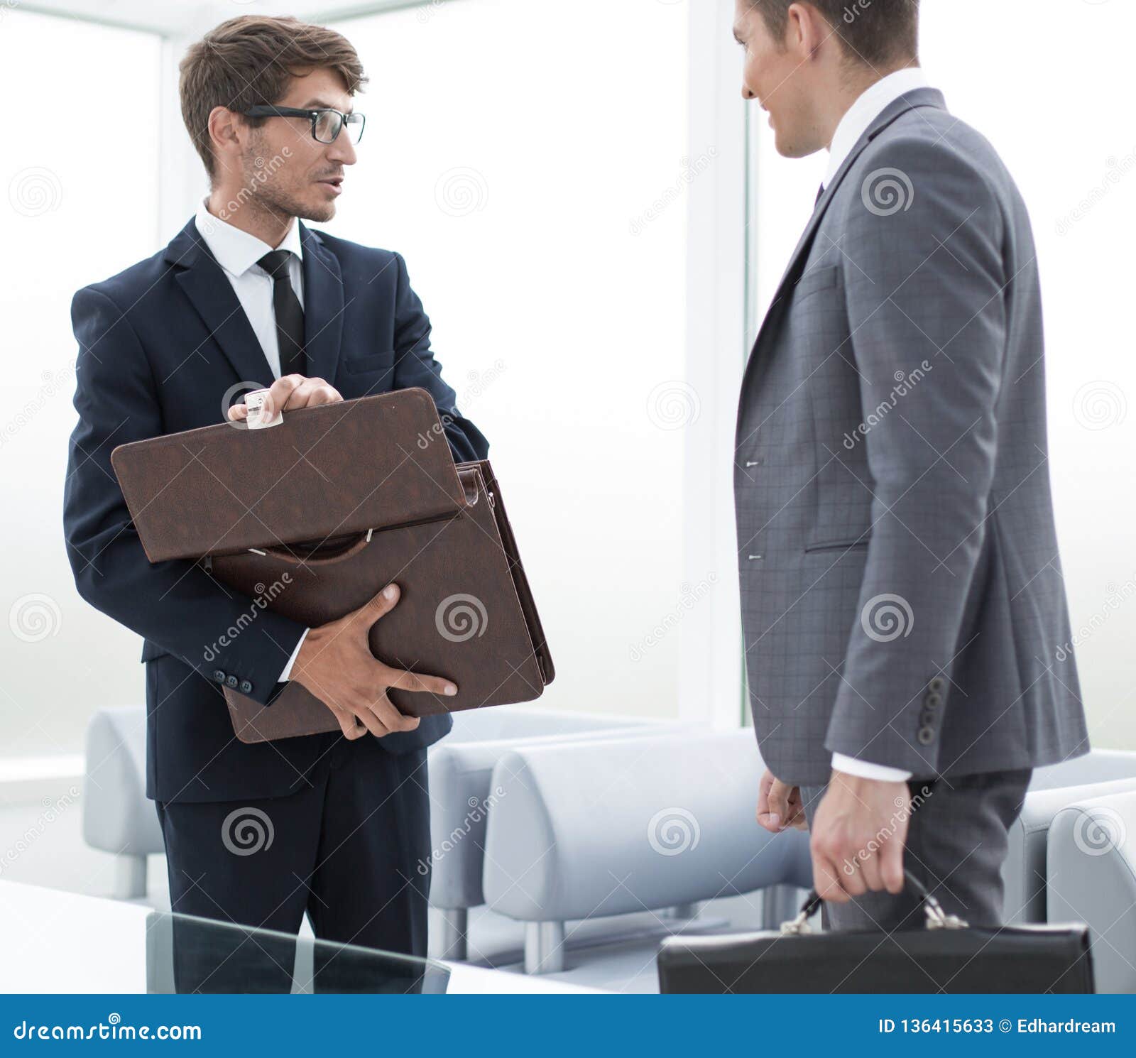 Business People Discussing Something while Standing in the Offic Stock ...