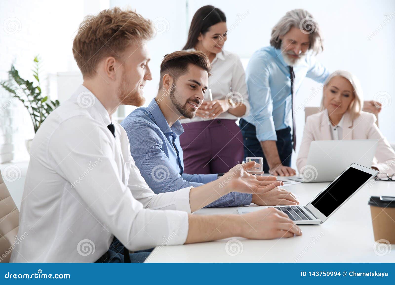Business People Discussing Work Matters in Office Stock Photo - Image ... Business People Discussing Work Matters in Office Stock Photo - Image ...