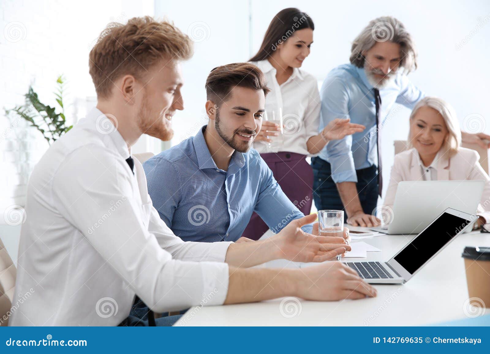 Business People Discussing Work Matters in Office Stock Image - Image ...