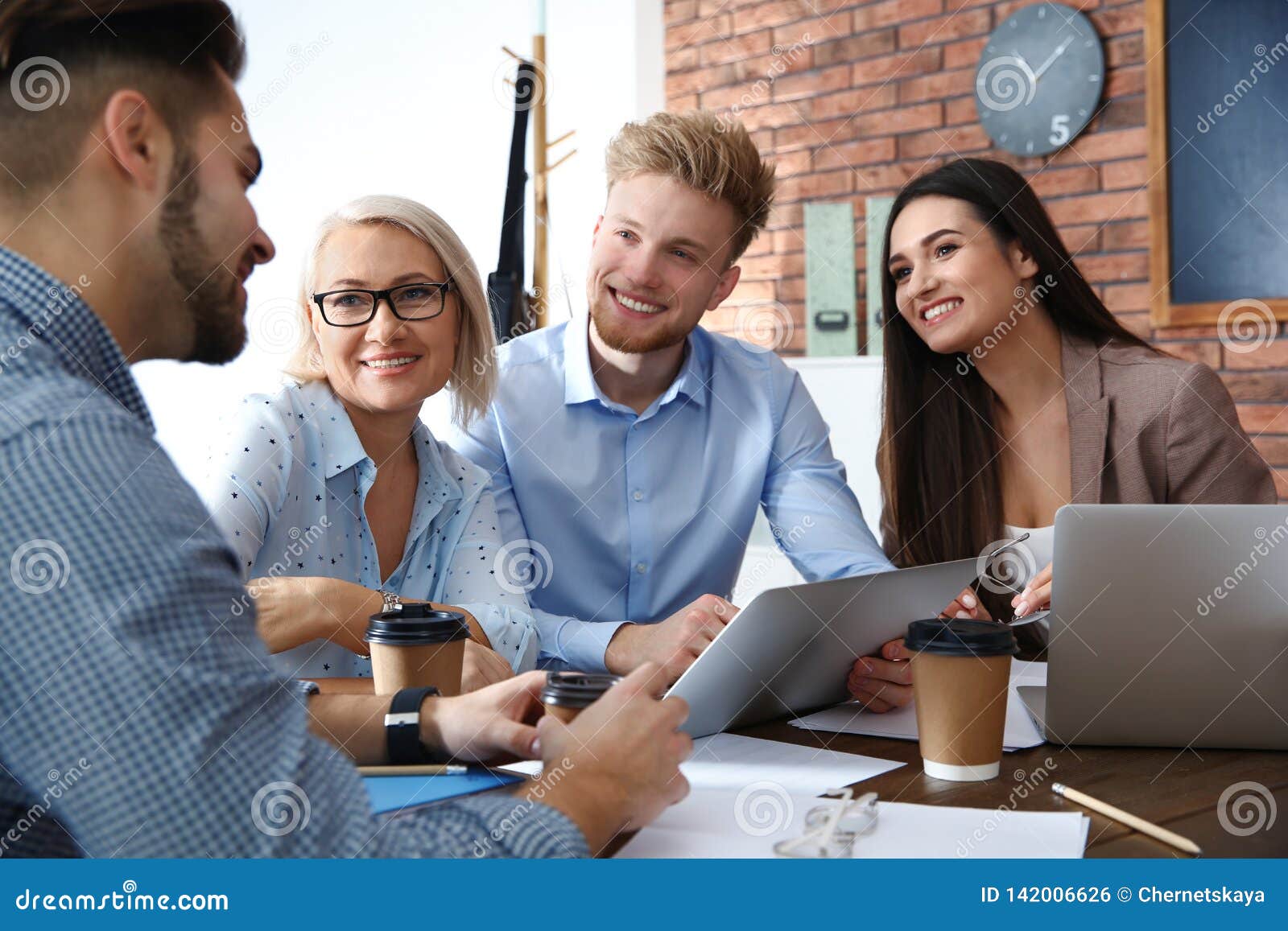Business People Discussing Work Matters at Table in Office. Stock Photo ...