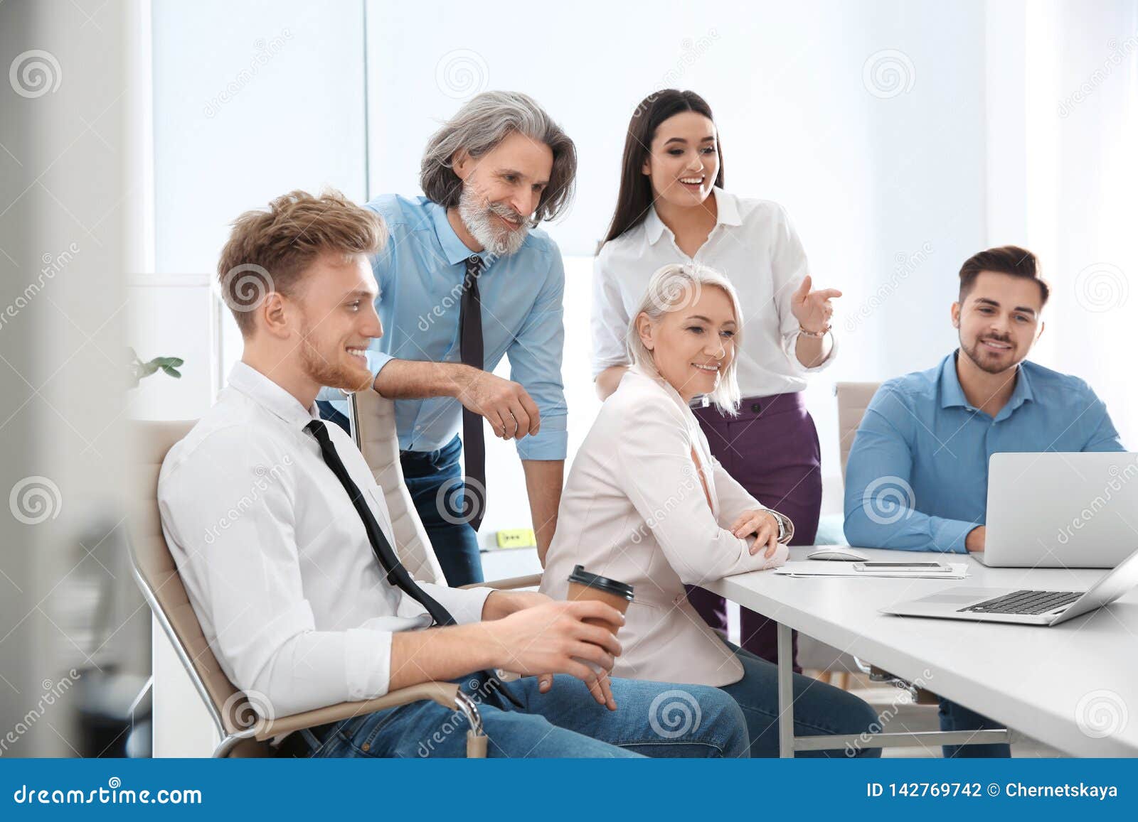 Business People Discussing Work Matters at Table in Office Stock Photo ...
