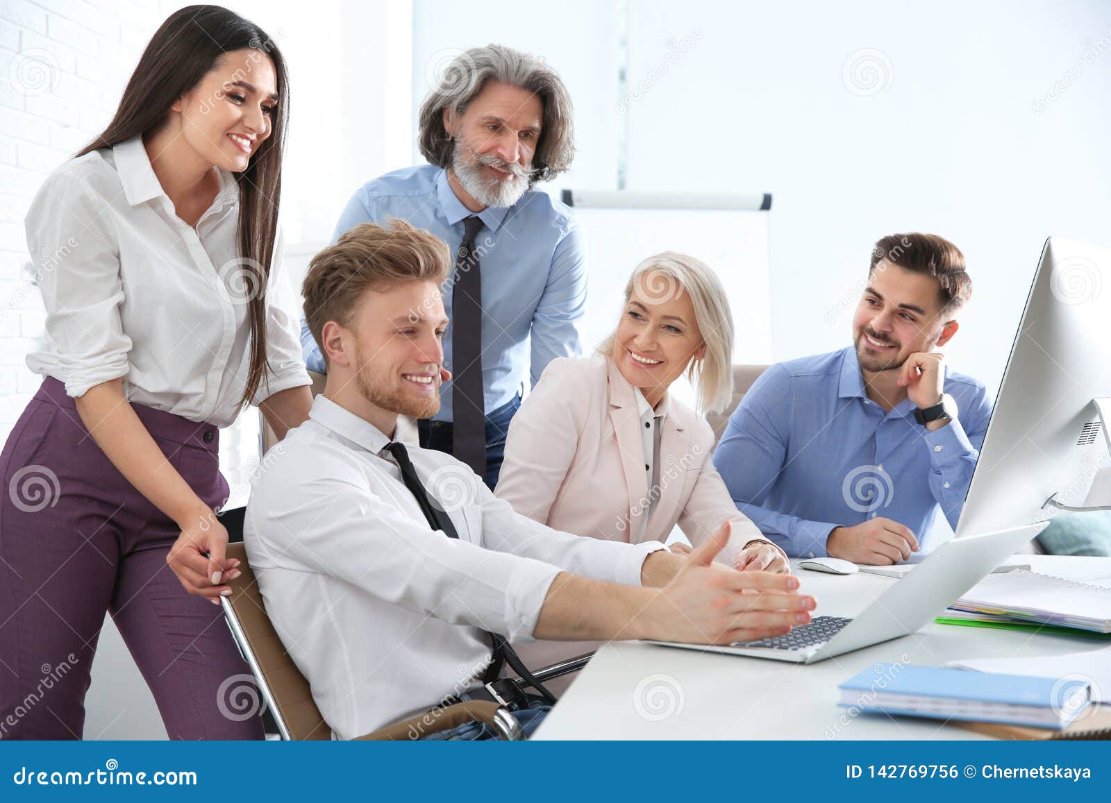 Business People Discussing Work Matters at Table in Office Stock Photo ...