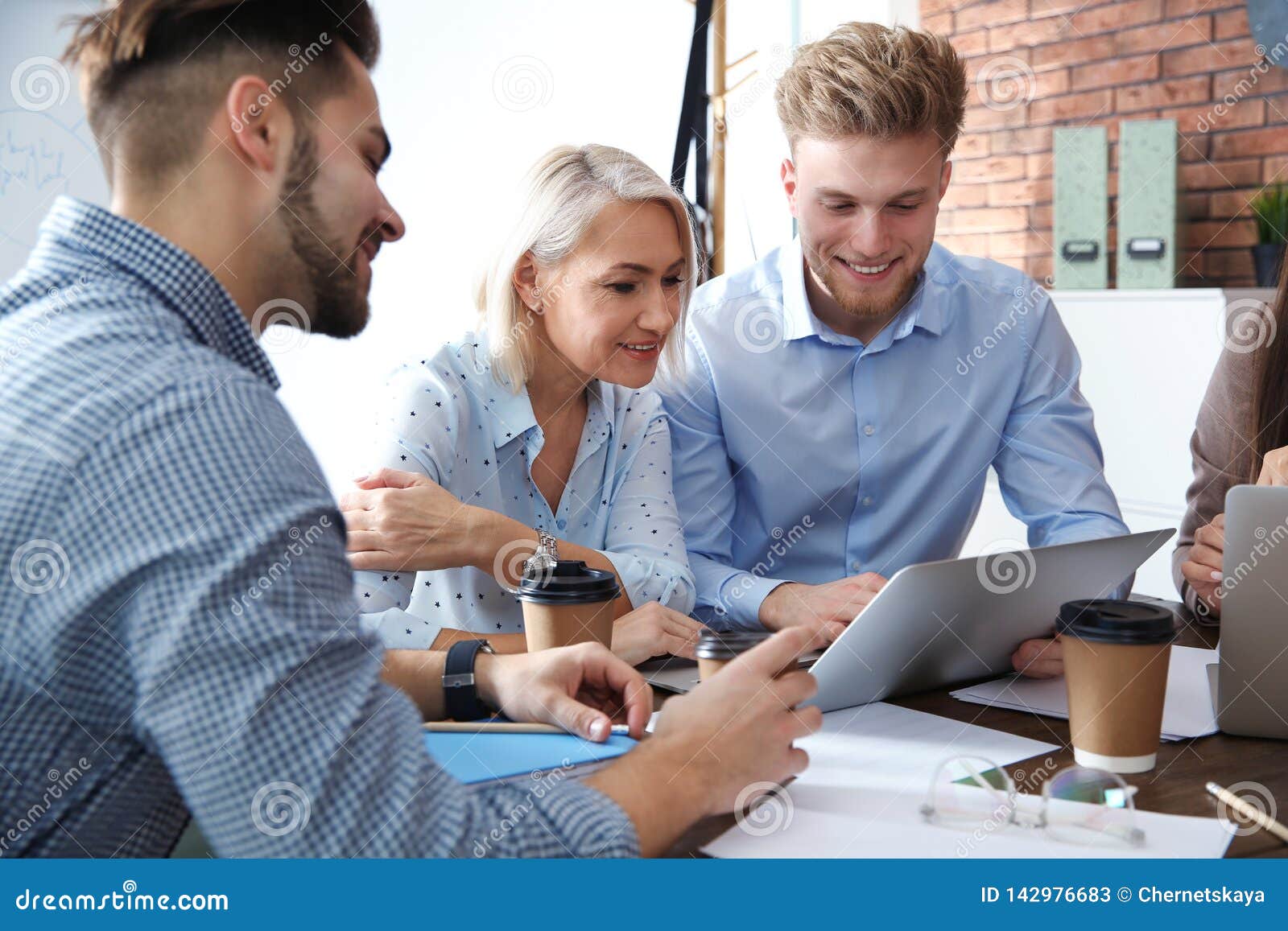 Business People Discussing Work Matters at Table in Office Stock Image ...