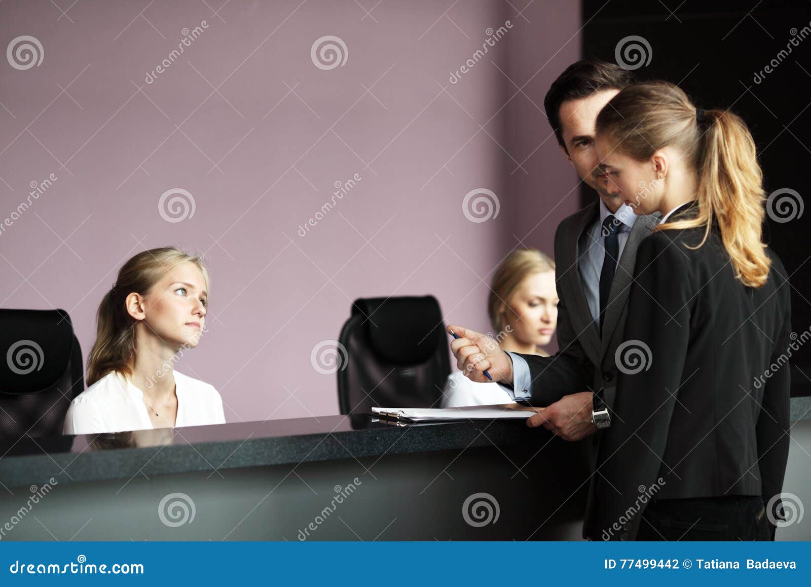 Business People at Front Desk Stock Photo - Image of professional ...