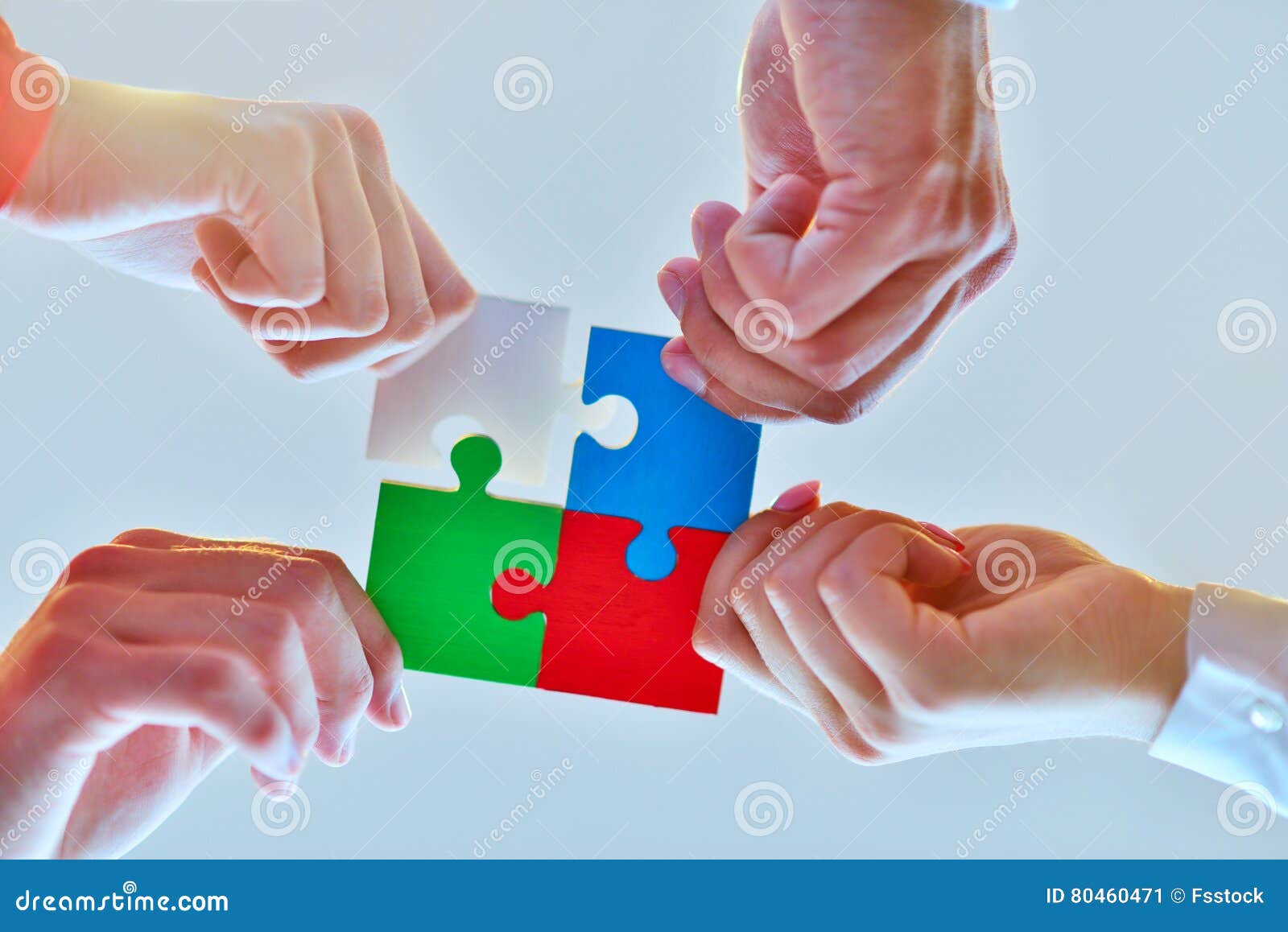 Business People Group Assembling Jigsaw Puzzle and Represent Team ...