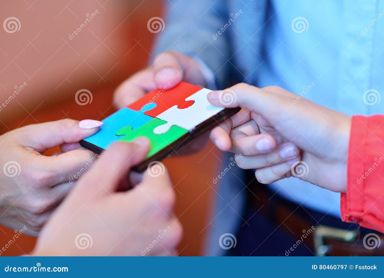 Business People Group Assembling Jigsaw Puzzle and Represent Team ...