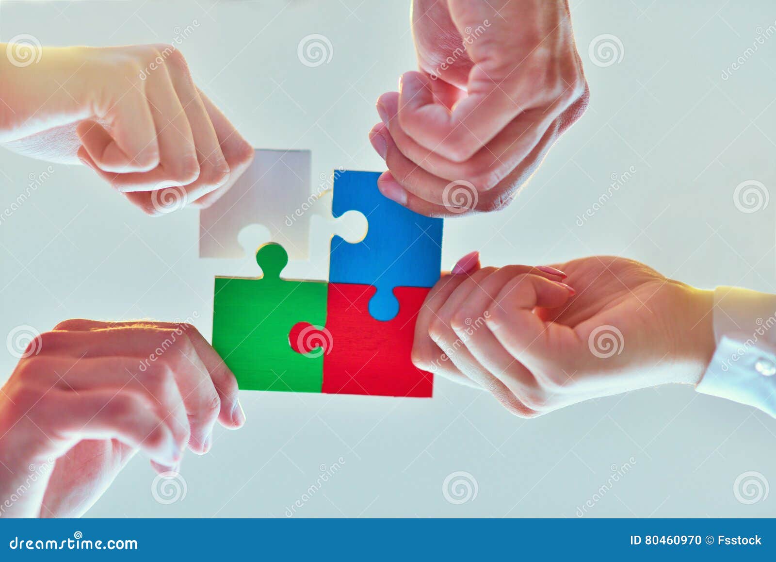 Business People Group Assembling Jigsaw Puzzle and Represent Team ...