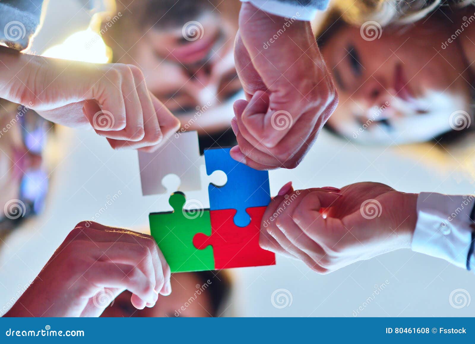 Business People Group Assembling Jigsaw Puzzle and Represent Team ...