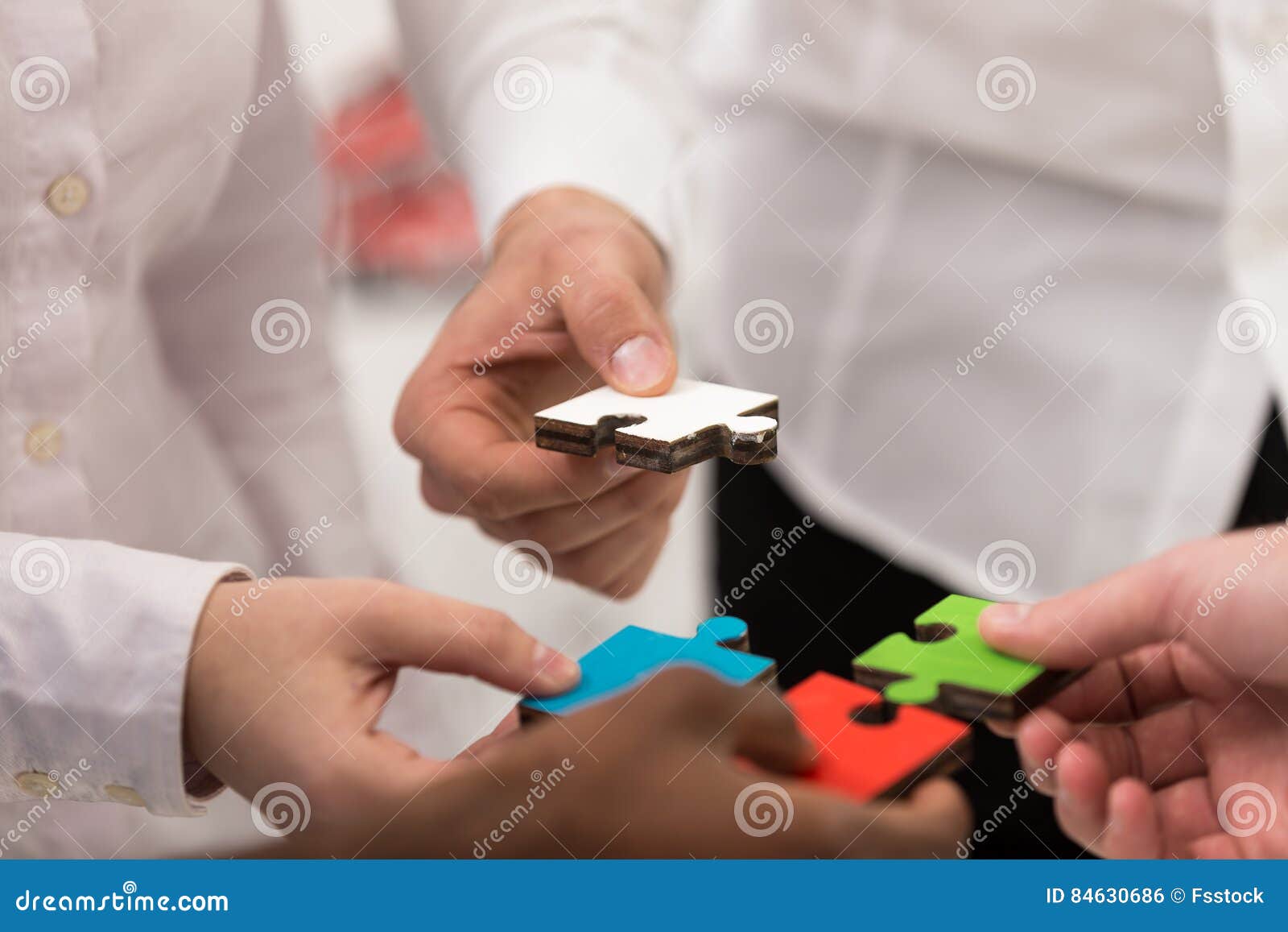 Business People Group Assembling Jigsaw Puzzle and Represent Team ...