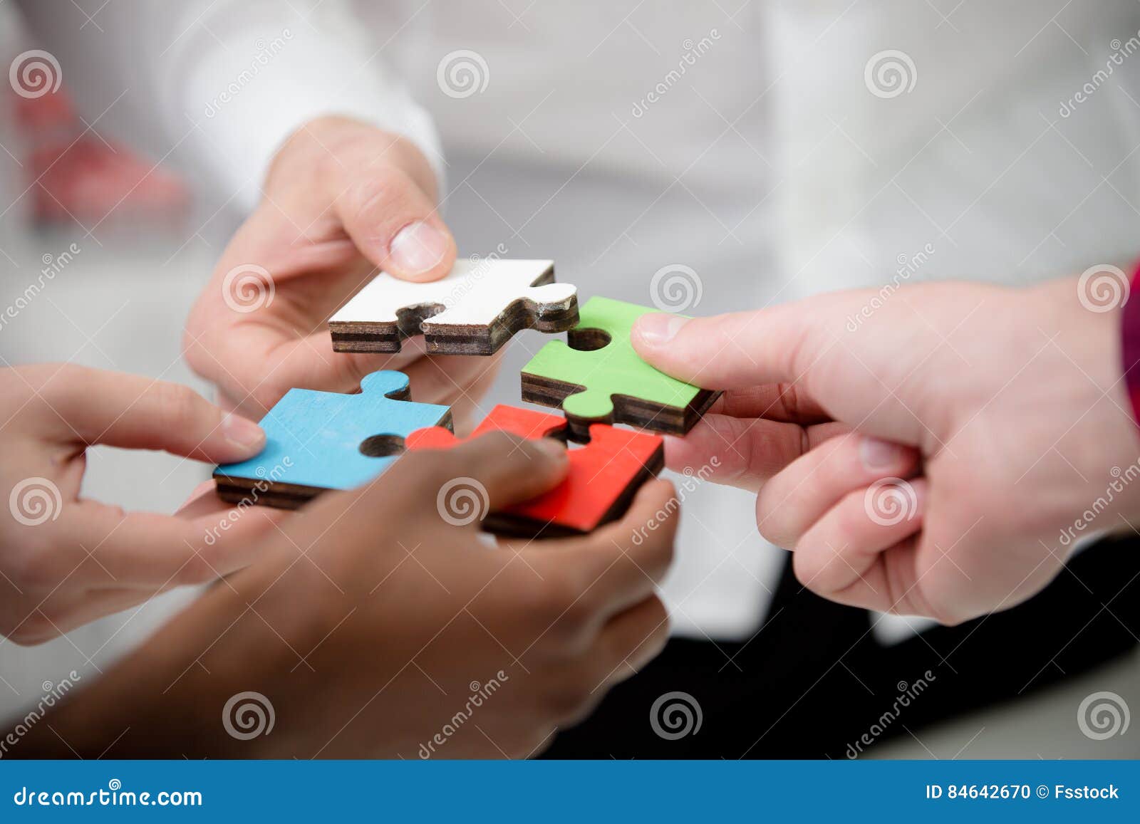 Business People Group Assembling Jigsaw Puzzle and Represent Team ...