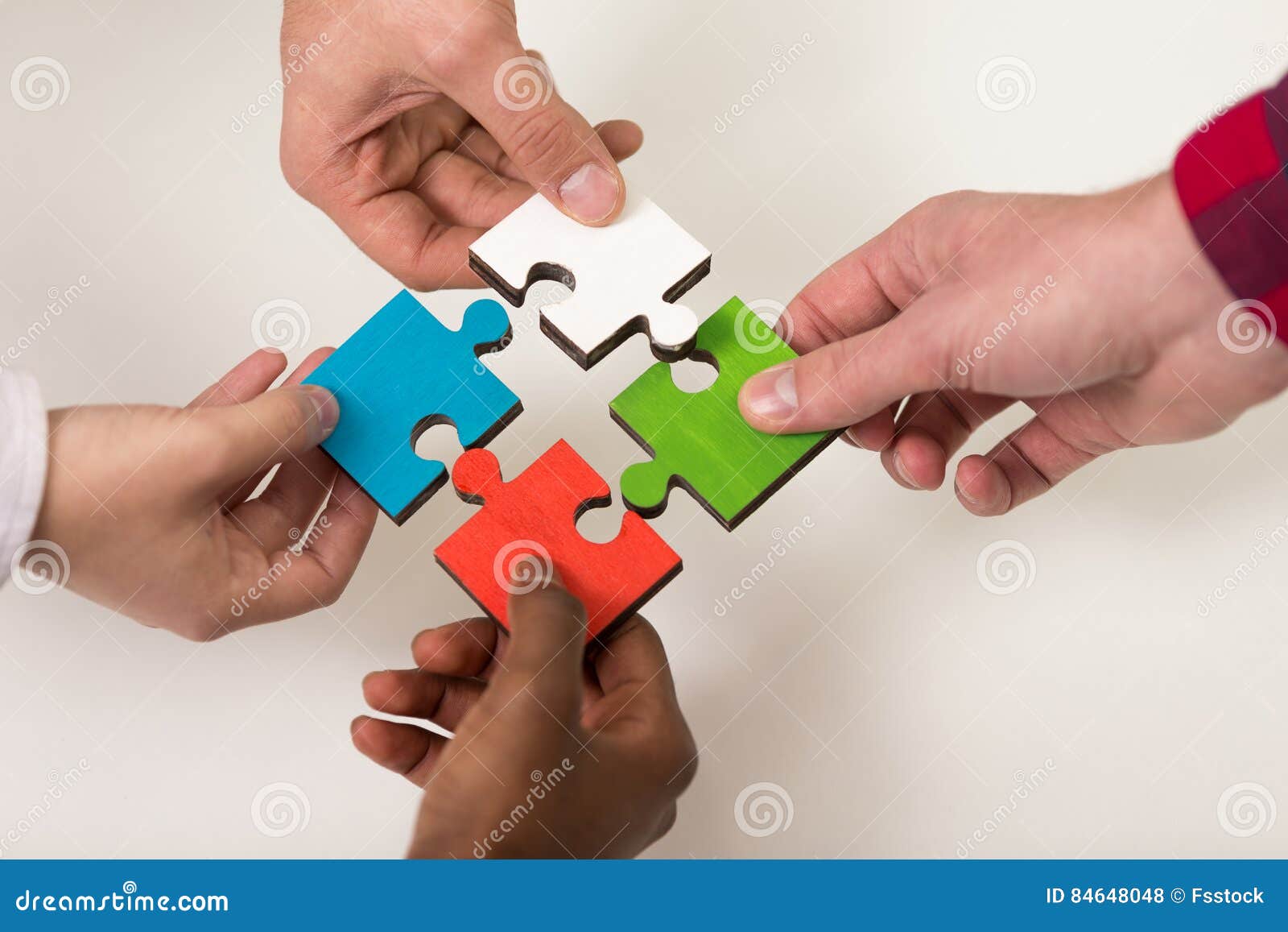 Business People Group Assembling Jigsaw Puzzle and Represent Team ...