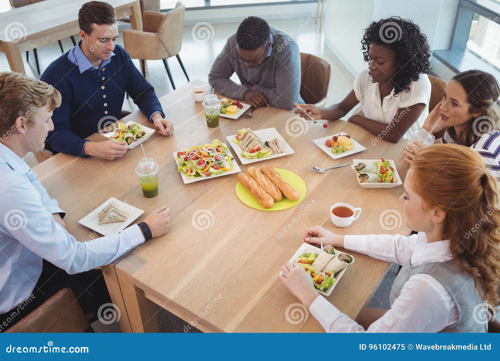 Business People Having Breakfast at Office Cafeteria Stock Image ...