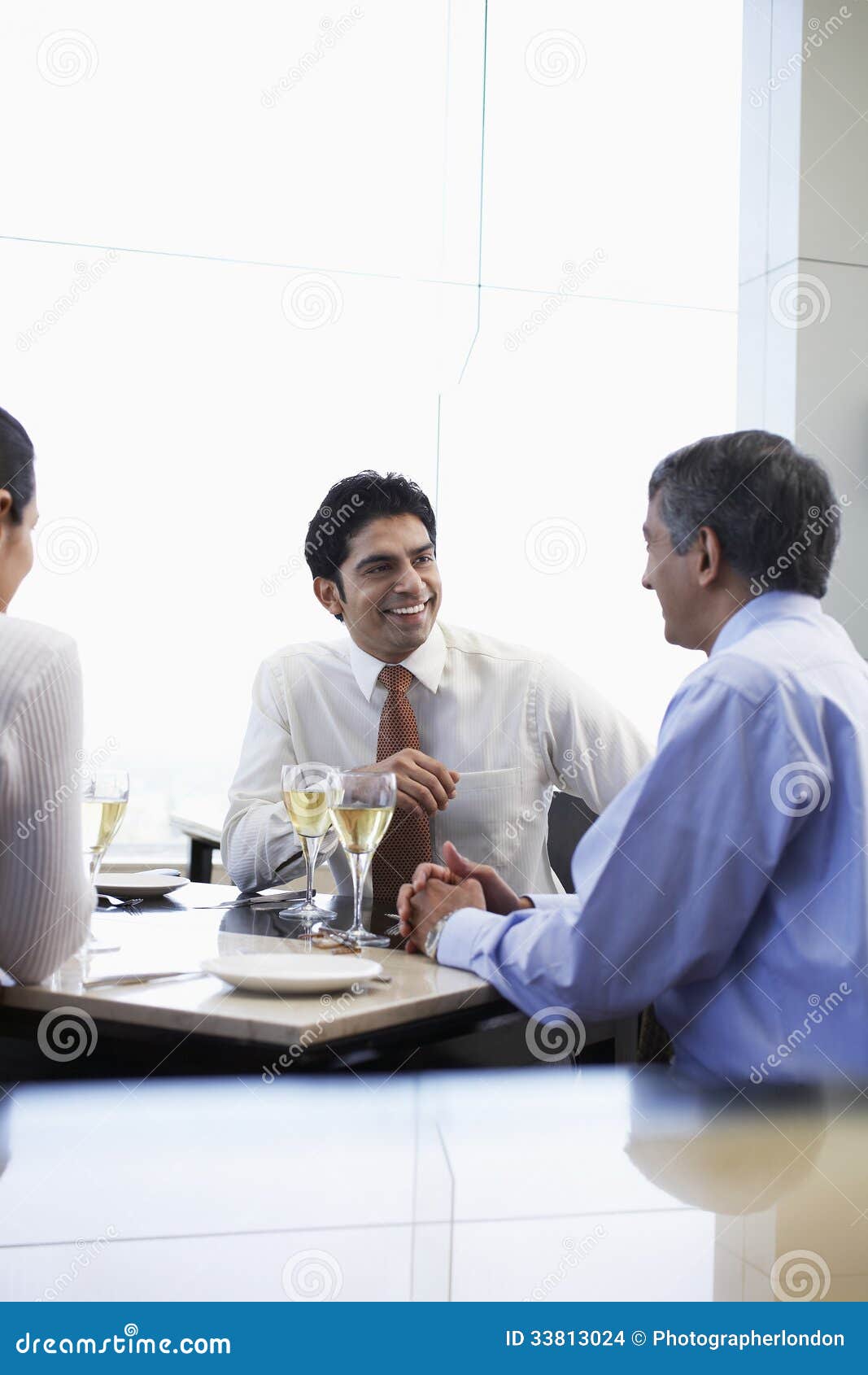 Business People Having Discussion at Restaurant Stock Photo - Image of ...
