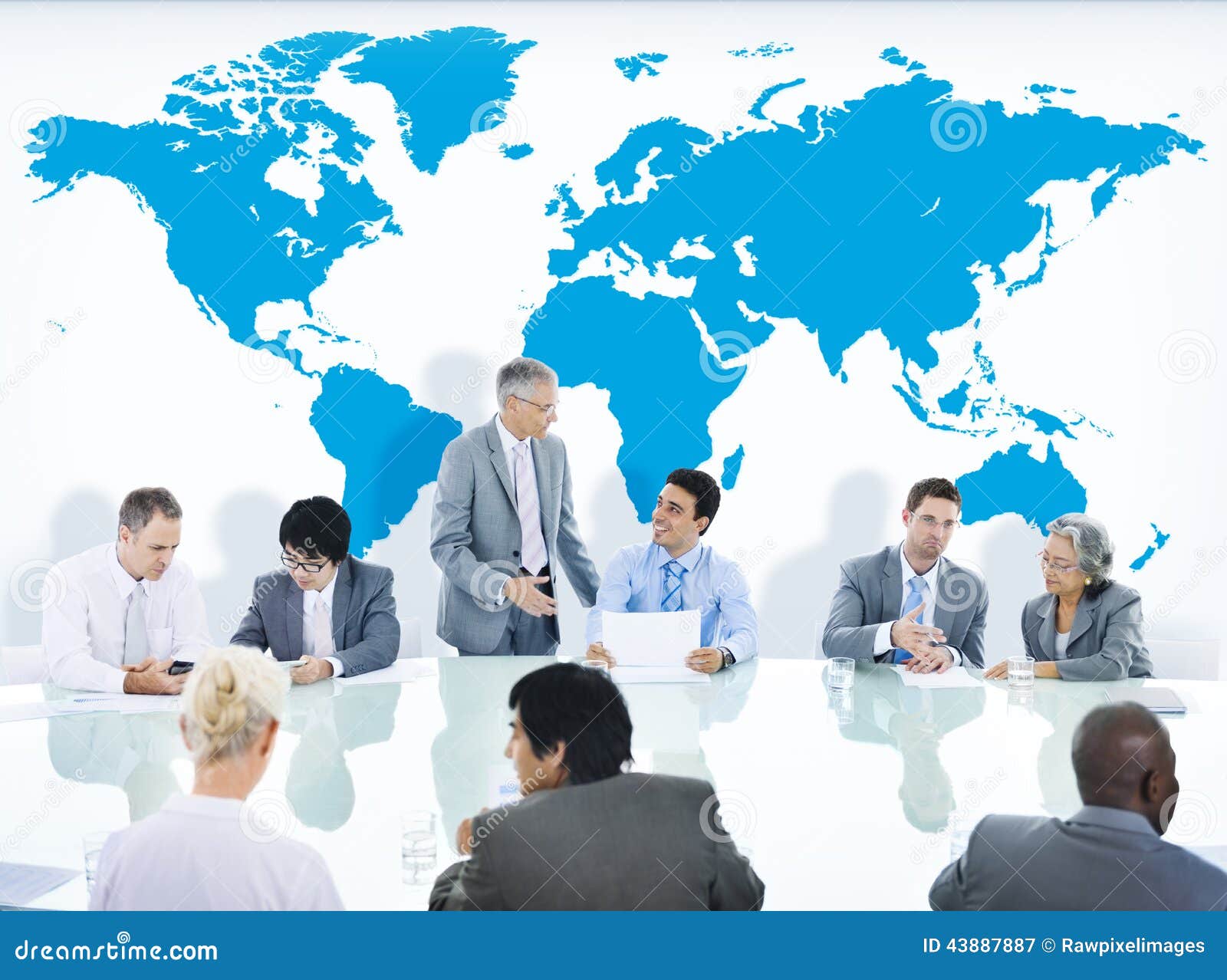 Business People Having a Discussion and World Map Stock Image - Image ...